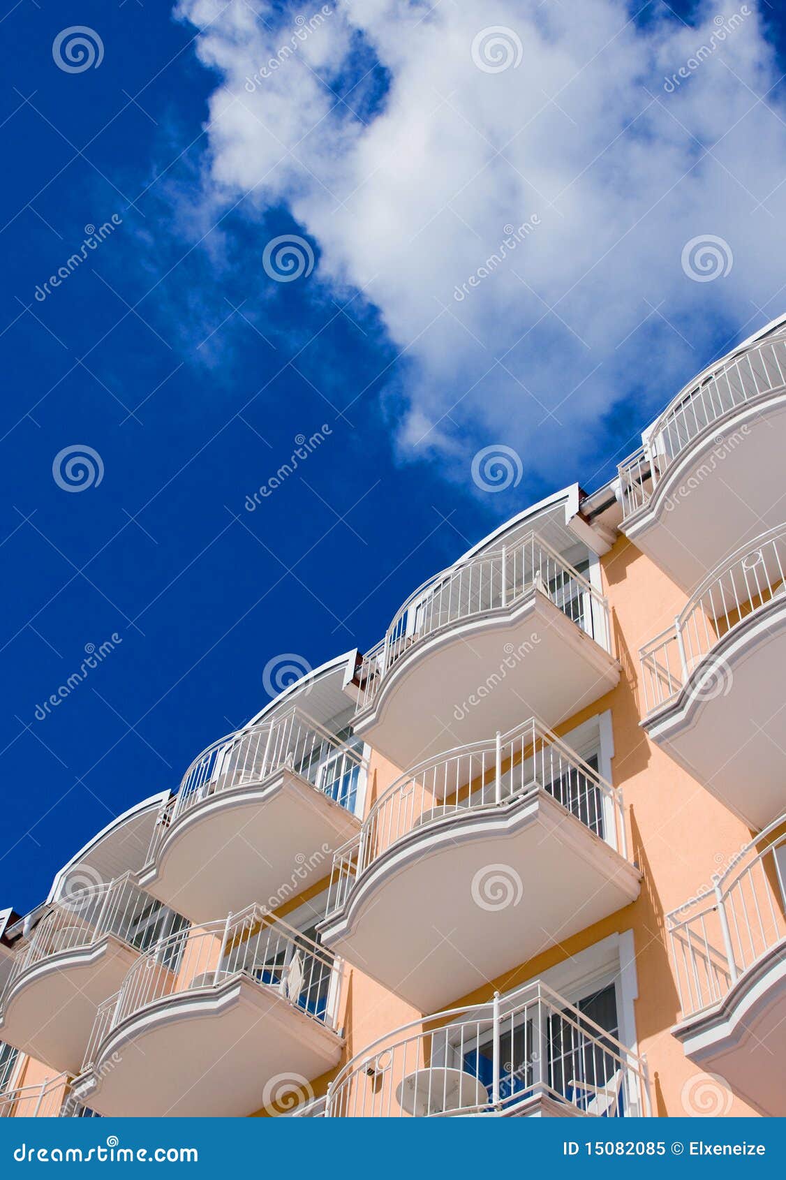 Orange Hotel in Front of a Blue Sky Stock Image - Image of building ...
