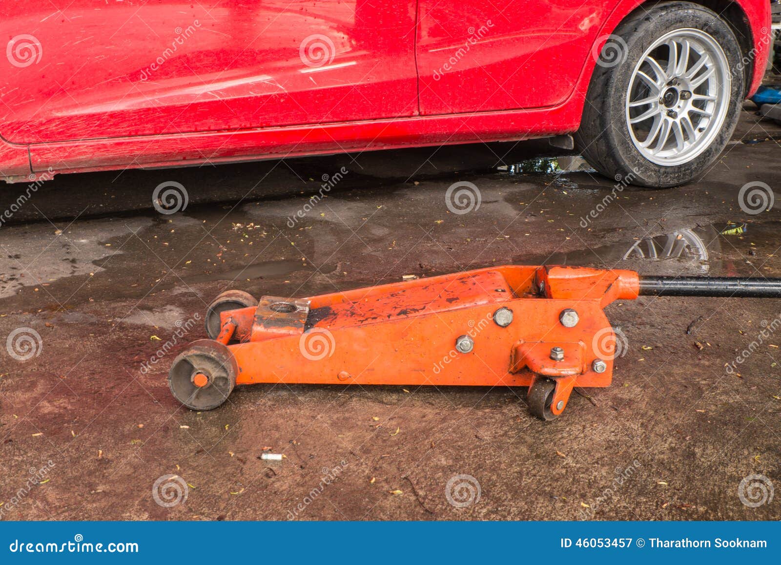 Orange Hydraulic Car Jack and Red Car Stock Image - Image of garage ...