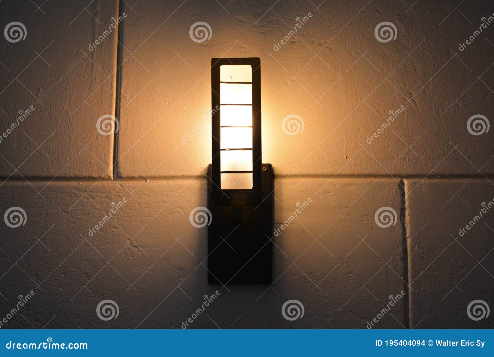 Orange Incandescent Light Bulb Mount on Wall Stock Photo - Image of ...