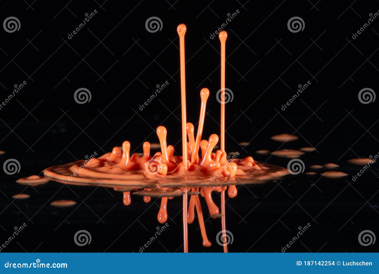 Orange Ink Splash on a Black Background Stock Photo - Image of liquid ...