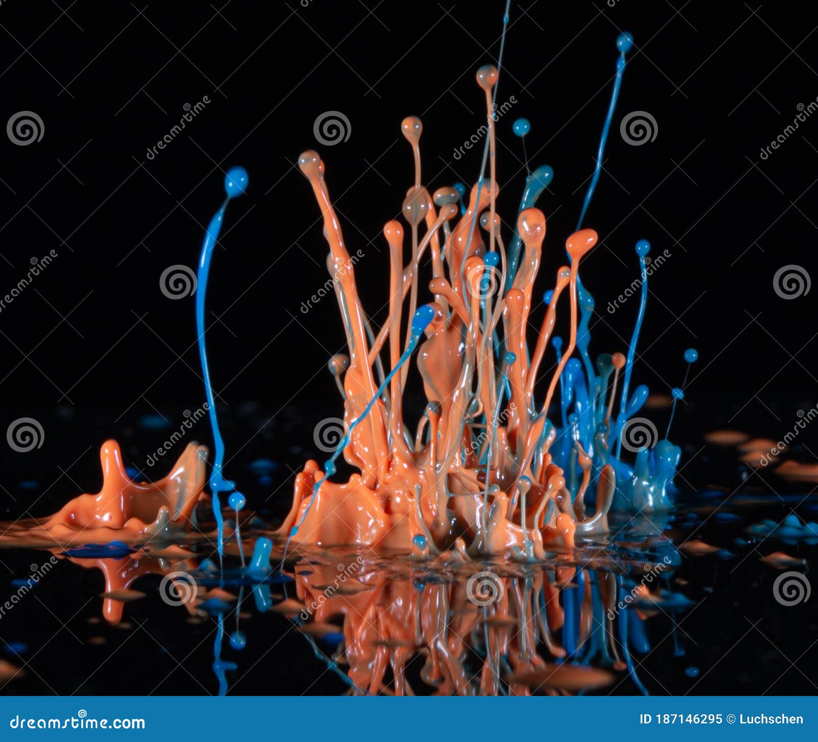 Orange Ink Splash on a Black Background Stock Image - Image of ...