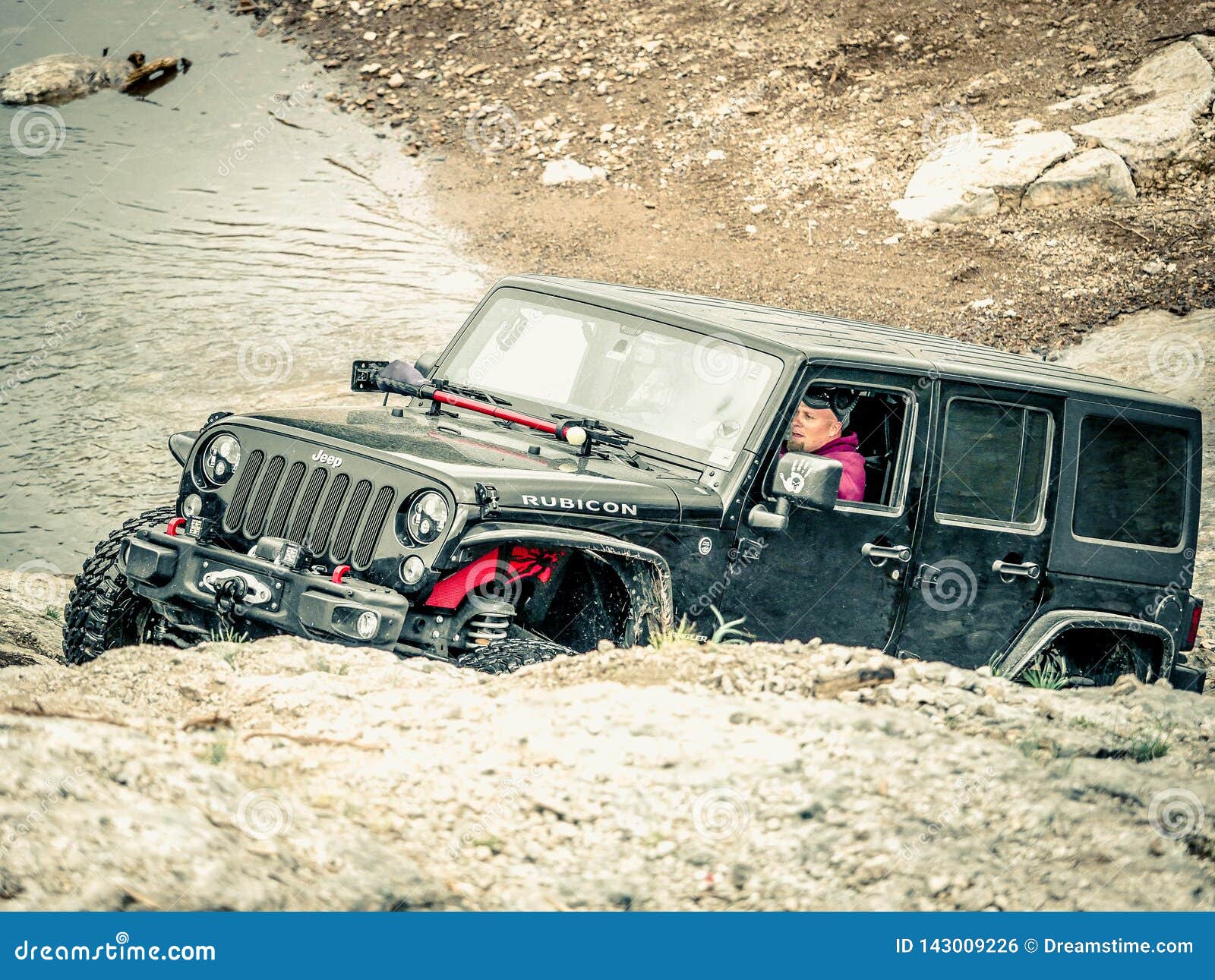 Orange Jeep Rock Crawling editorial photo. Image of black - 143009226