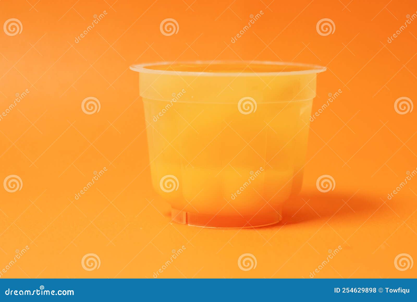 Orange Jelly in a Plastic Container Stock Photo - Image of food, flavor ...