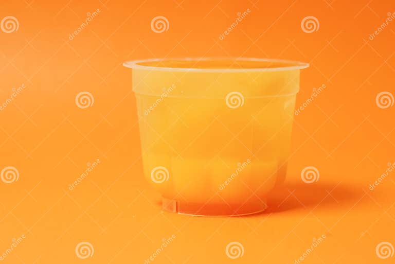 Orange Jelly in a Plastic Container Stock Photo - Image of food, flavor ...