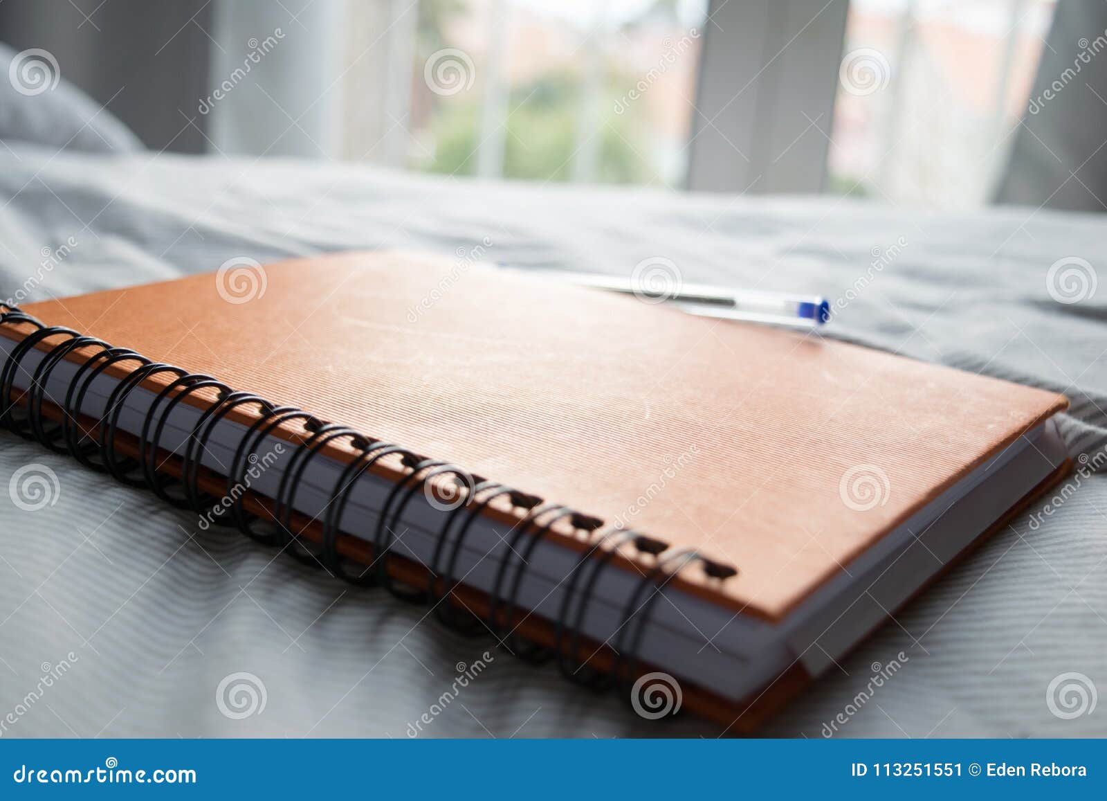 Orange Journal Notebook with Pen on Bed. Stock Image - Image of journal ...