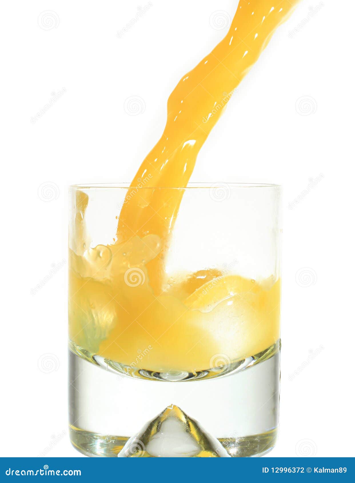 Orange juice pouring stock photo. Image of explosion - 12996372