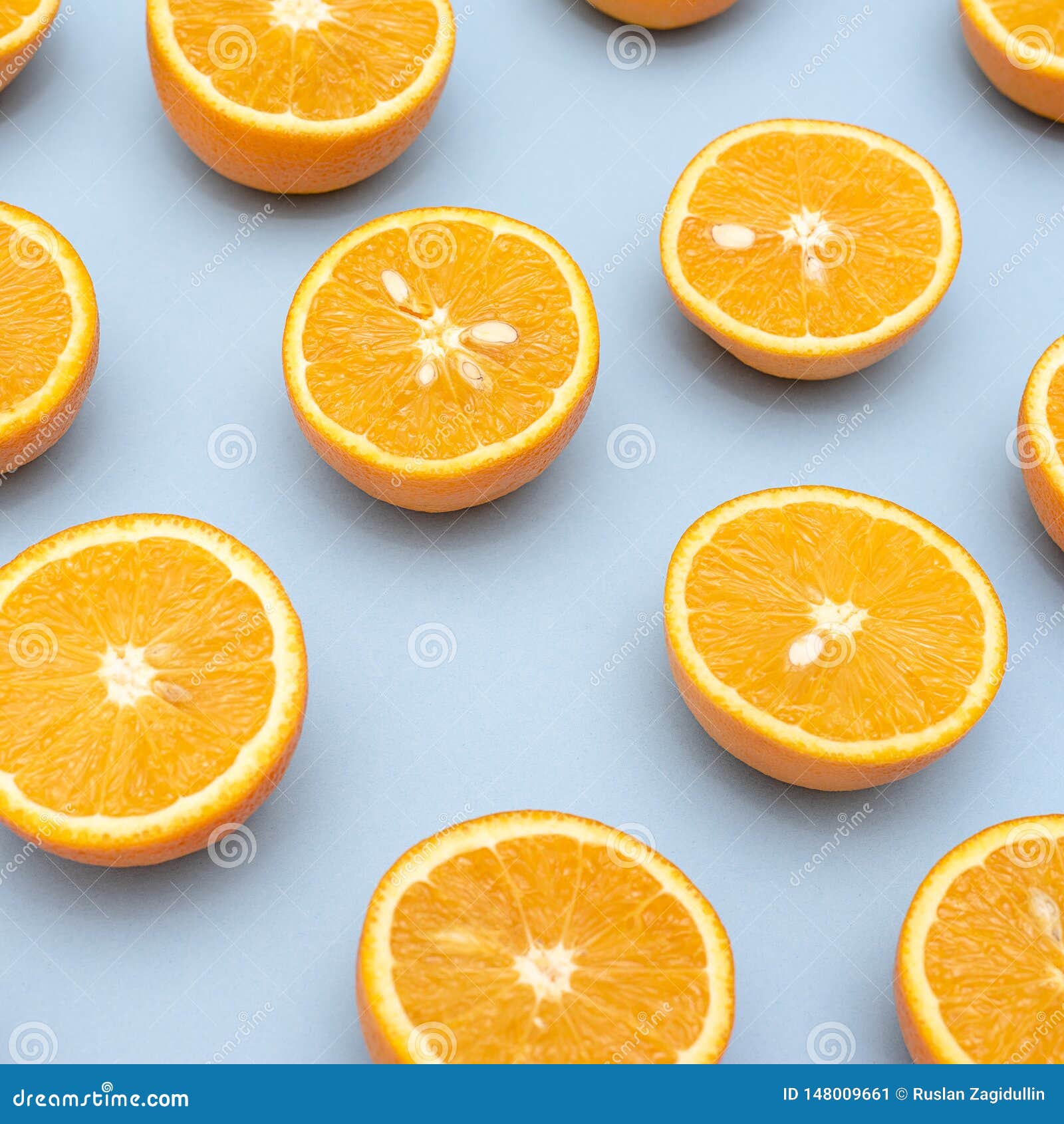 Orange Juicy Oranges Split in Half on Blue Stock Image - Image of slice ...