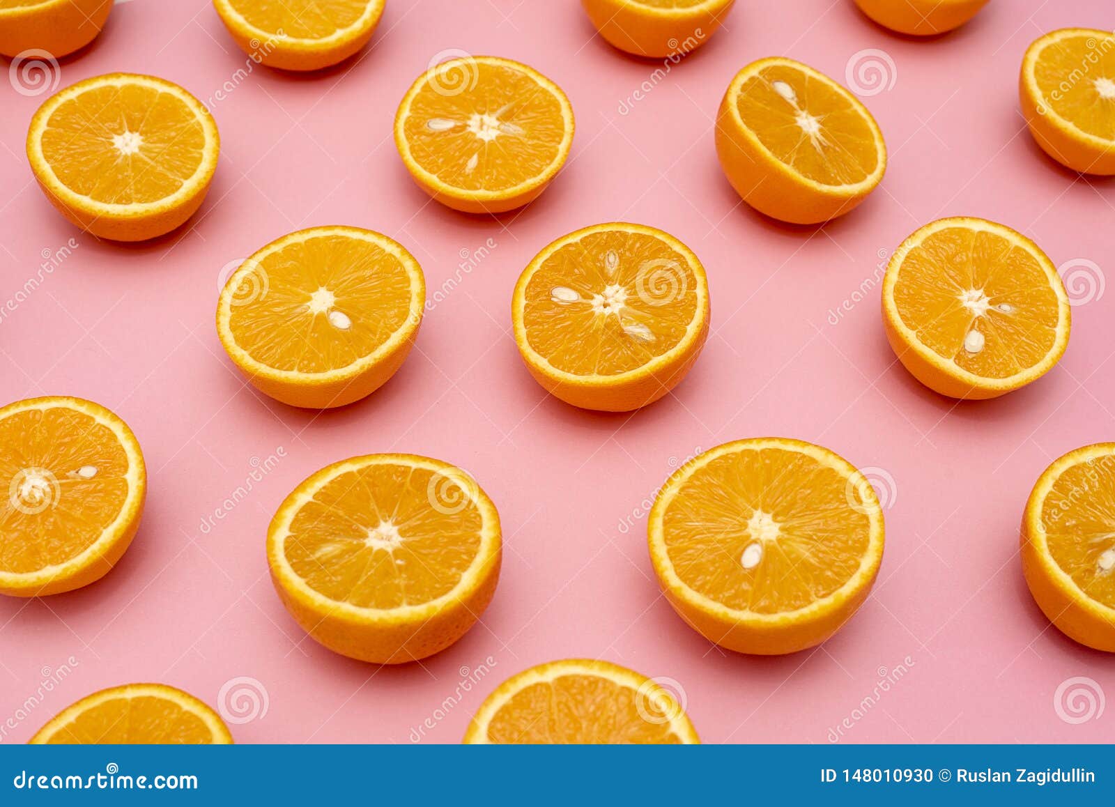 Orange Juicy Oranges Split in Half on Pink Stock Photo - Image of ...