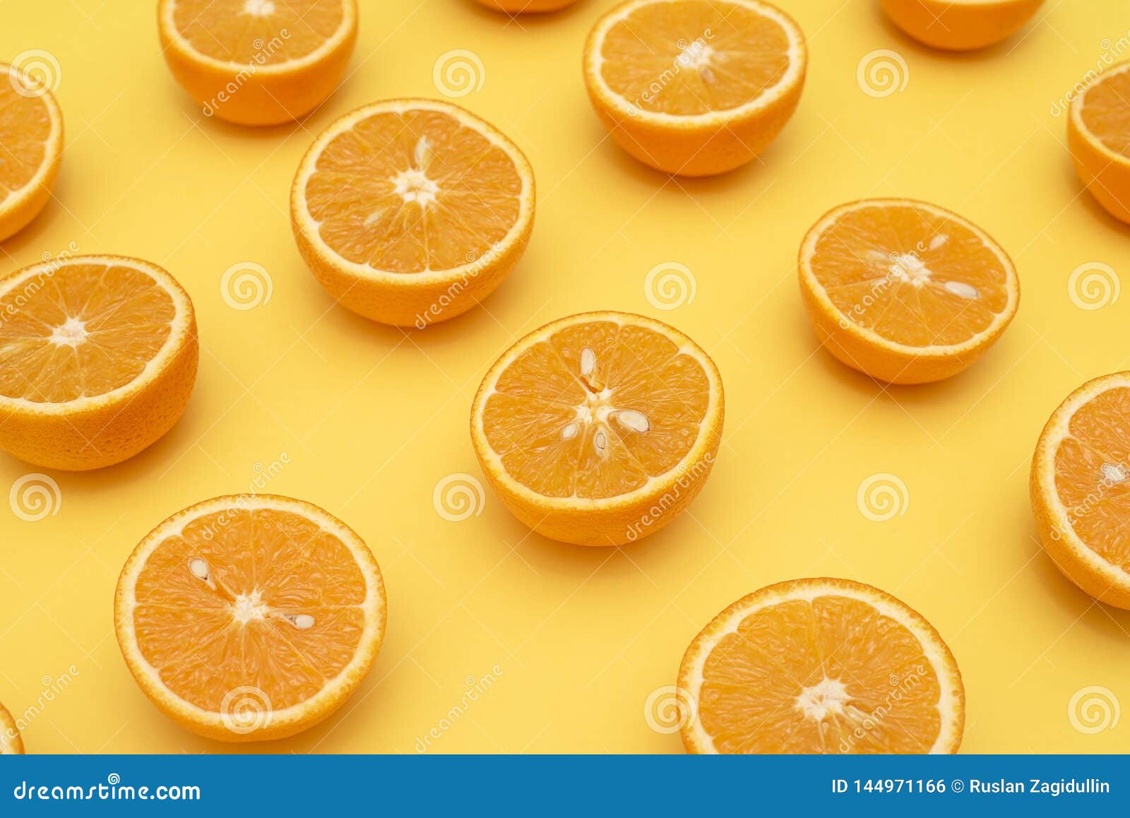 Orange Juicy Oranges Split in Half on Yellow Stock Photo - Image of ...