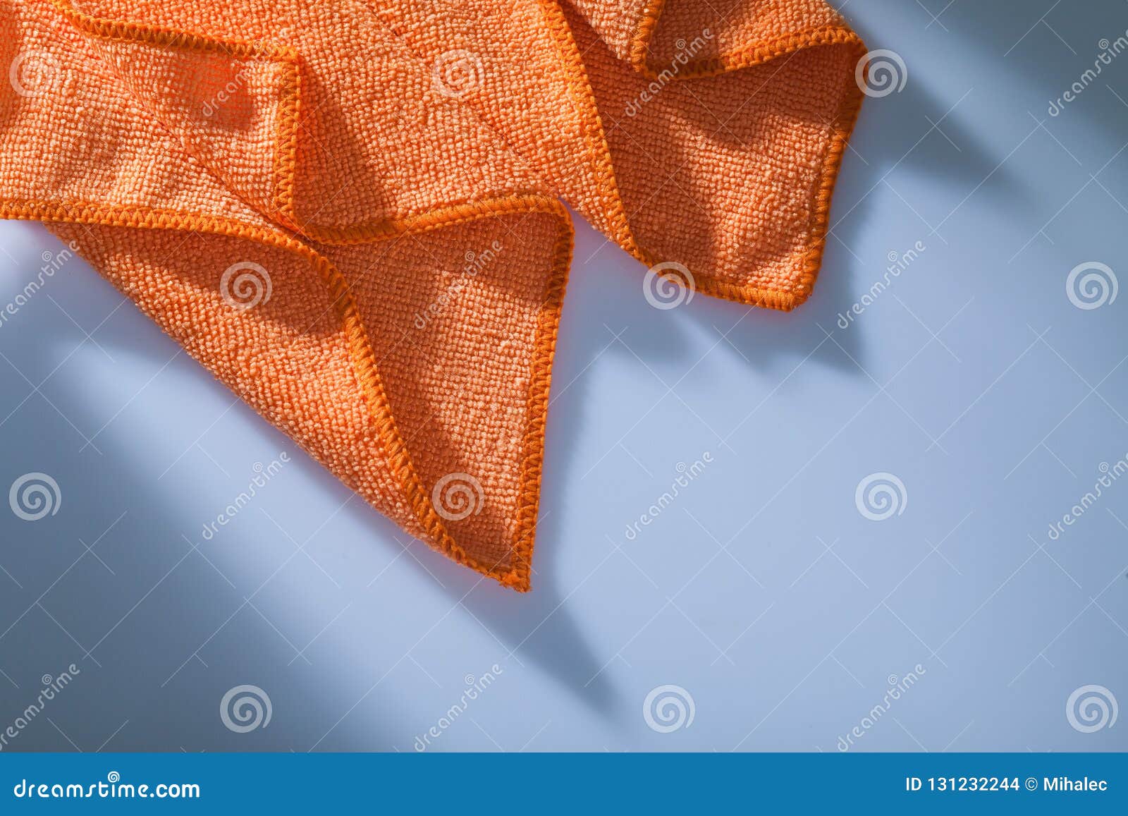 Orange Kitchen Dishwashing Rag on White Surface Stock Photo - Image of ...