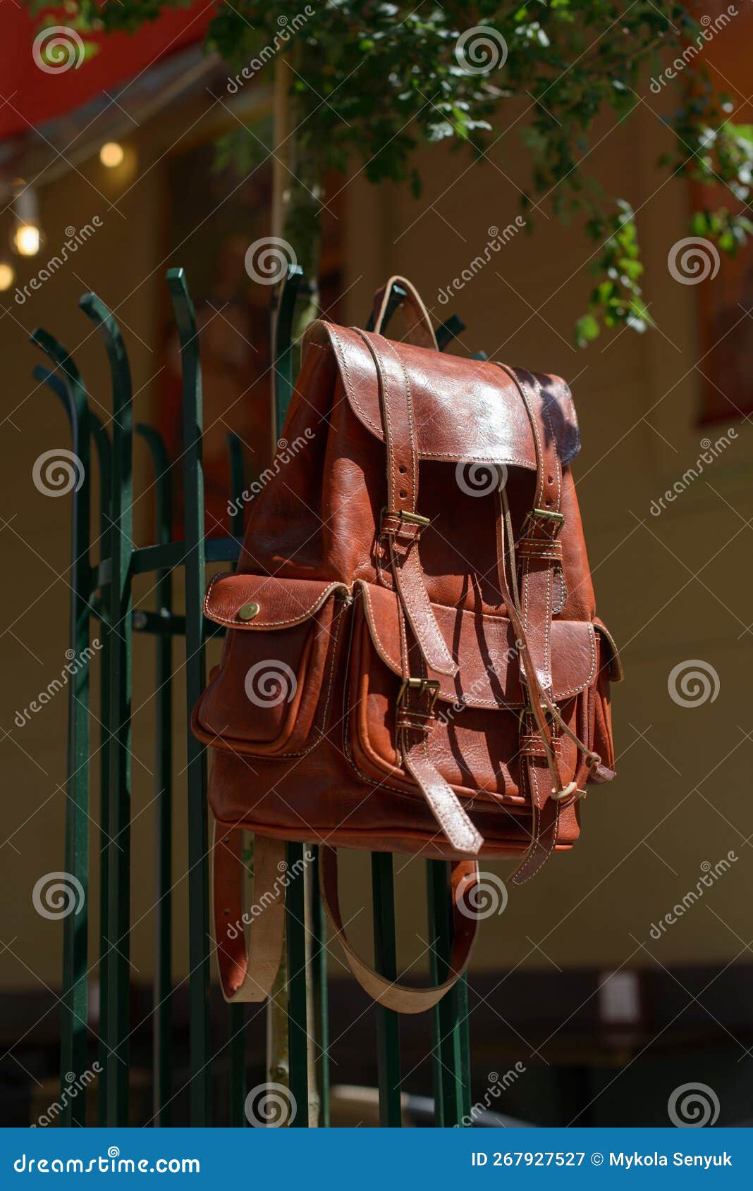 Orange Leather Oldfashioned Backpack on a Metal Grid Stock Image ...