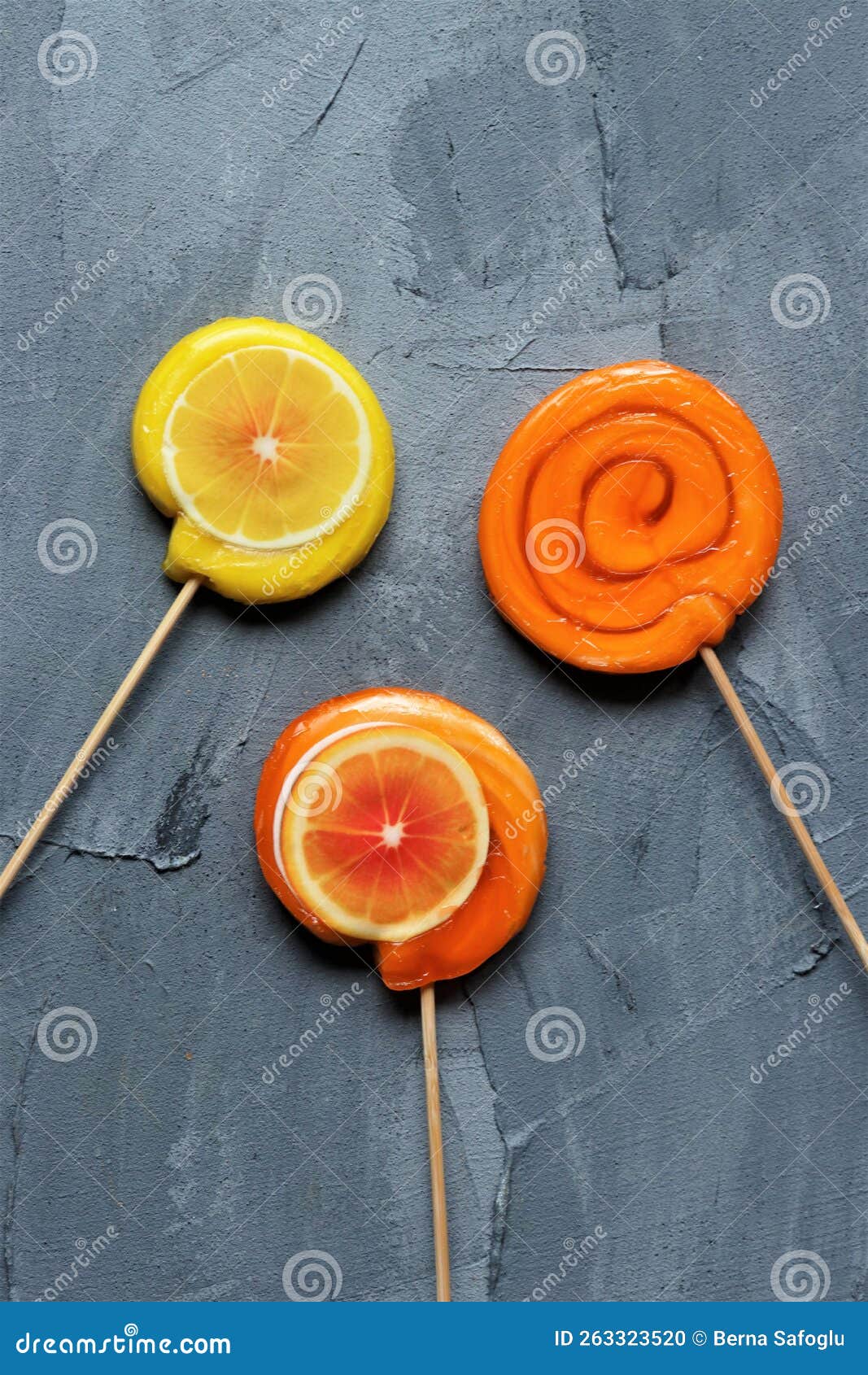 Orange and Lemon Lollipops on a Grey Background Stock Photo - Image of ...