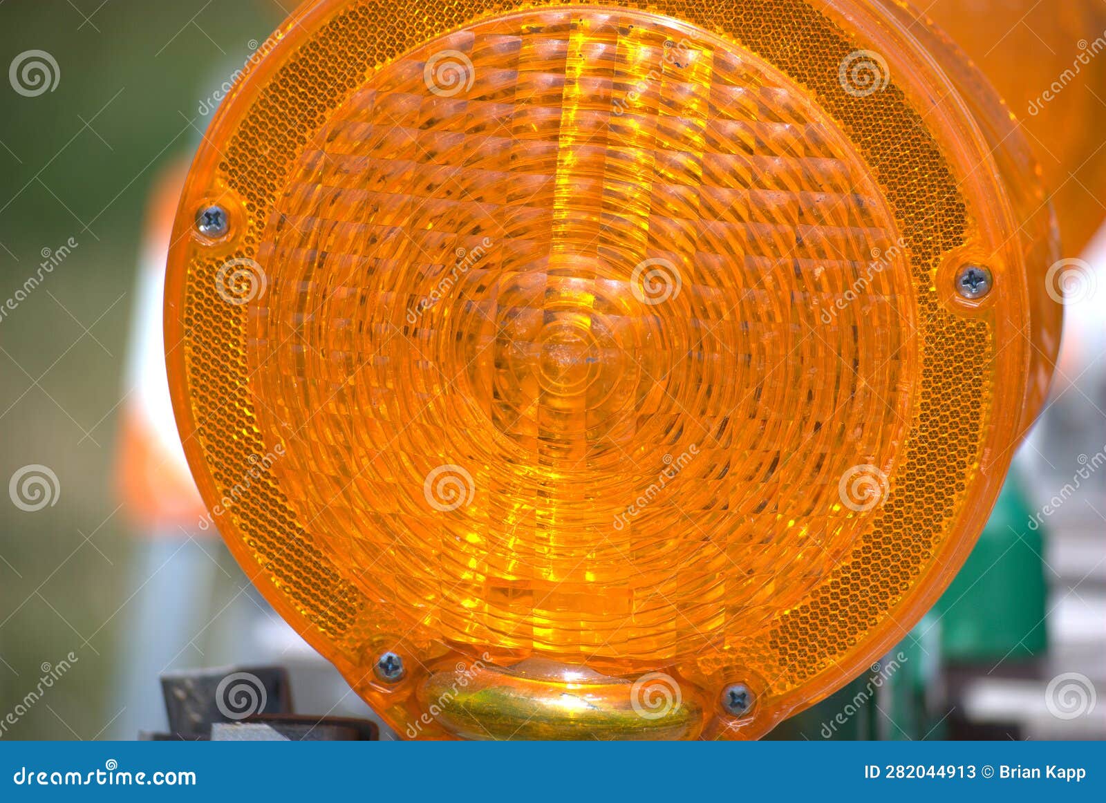 The Orange Lens of a Construction Barricade Light Contains Some ...