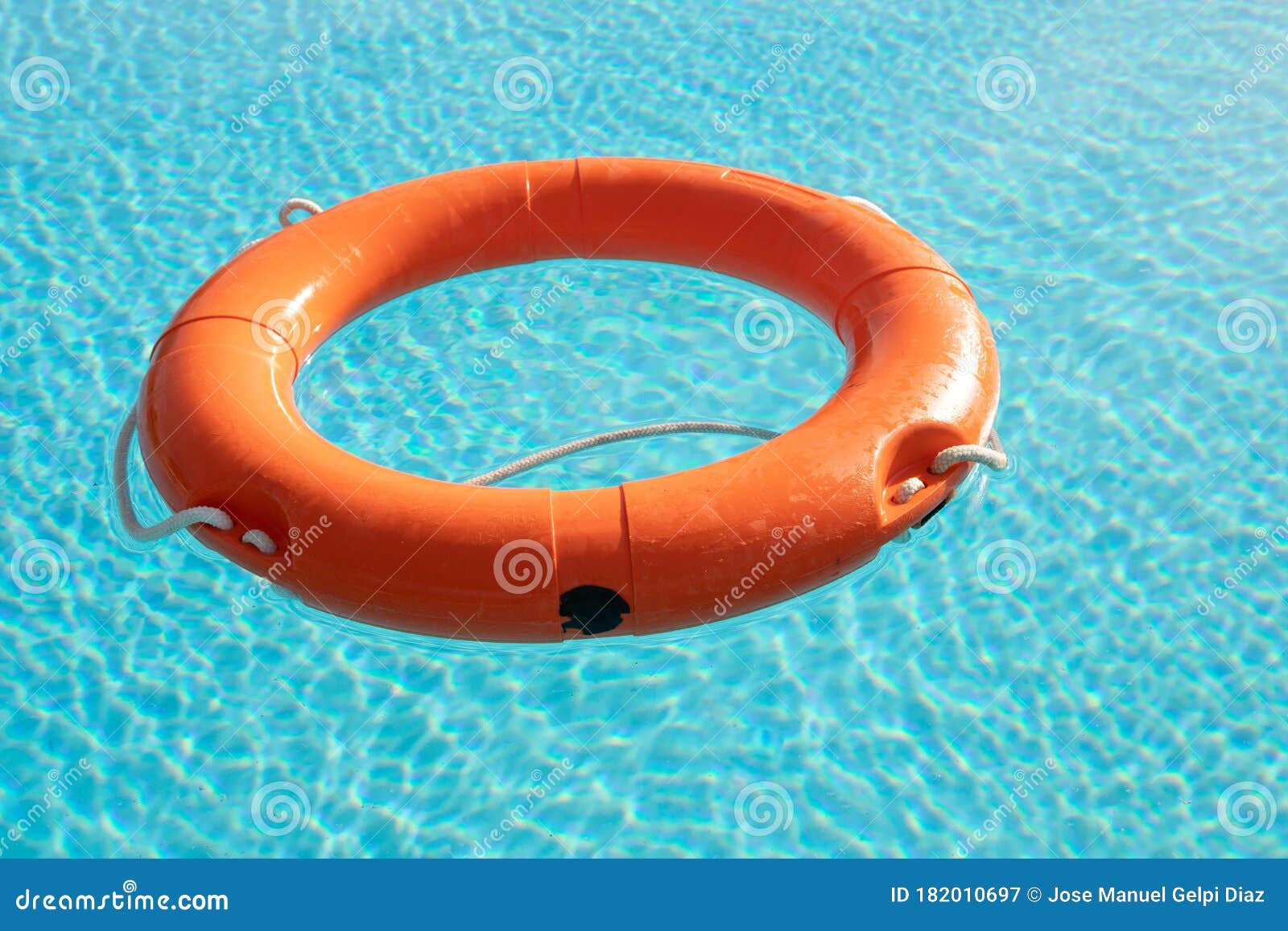 Orange Lifebuoy Floating on a Pool Stock Image - Image of clear, float ...