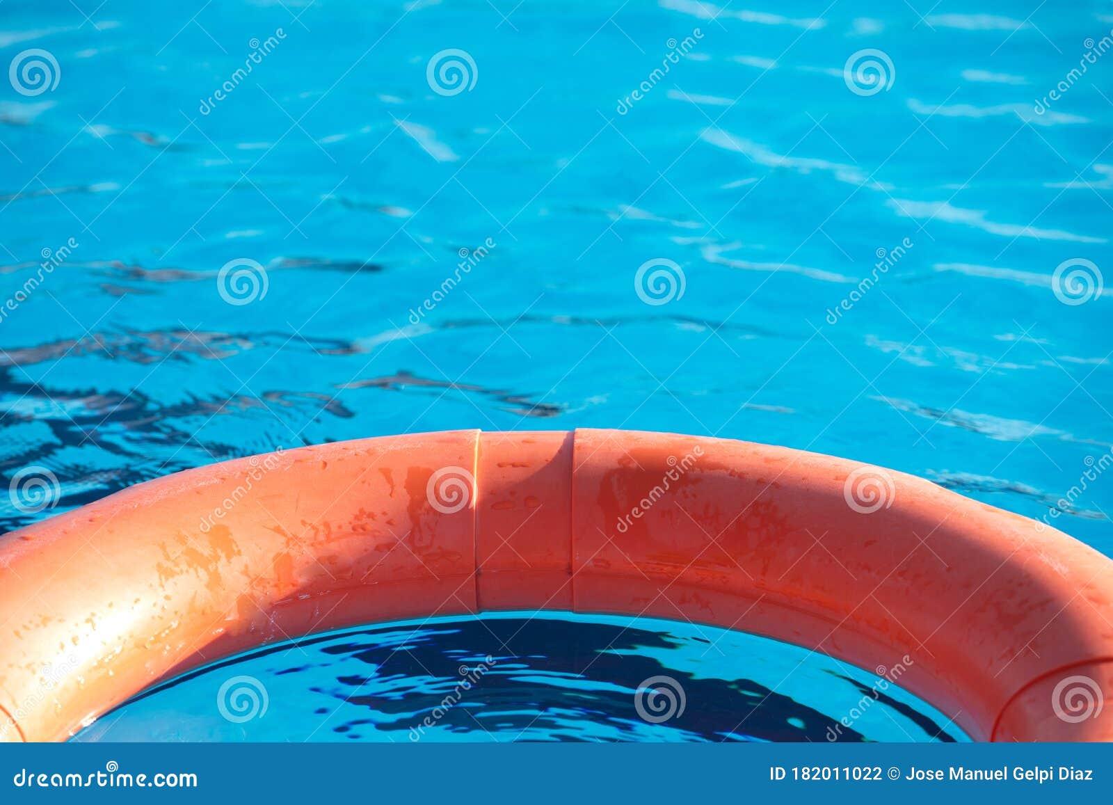 Orange Lifebuoy Floating on a Pool Stock Photo - Image of competition ...