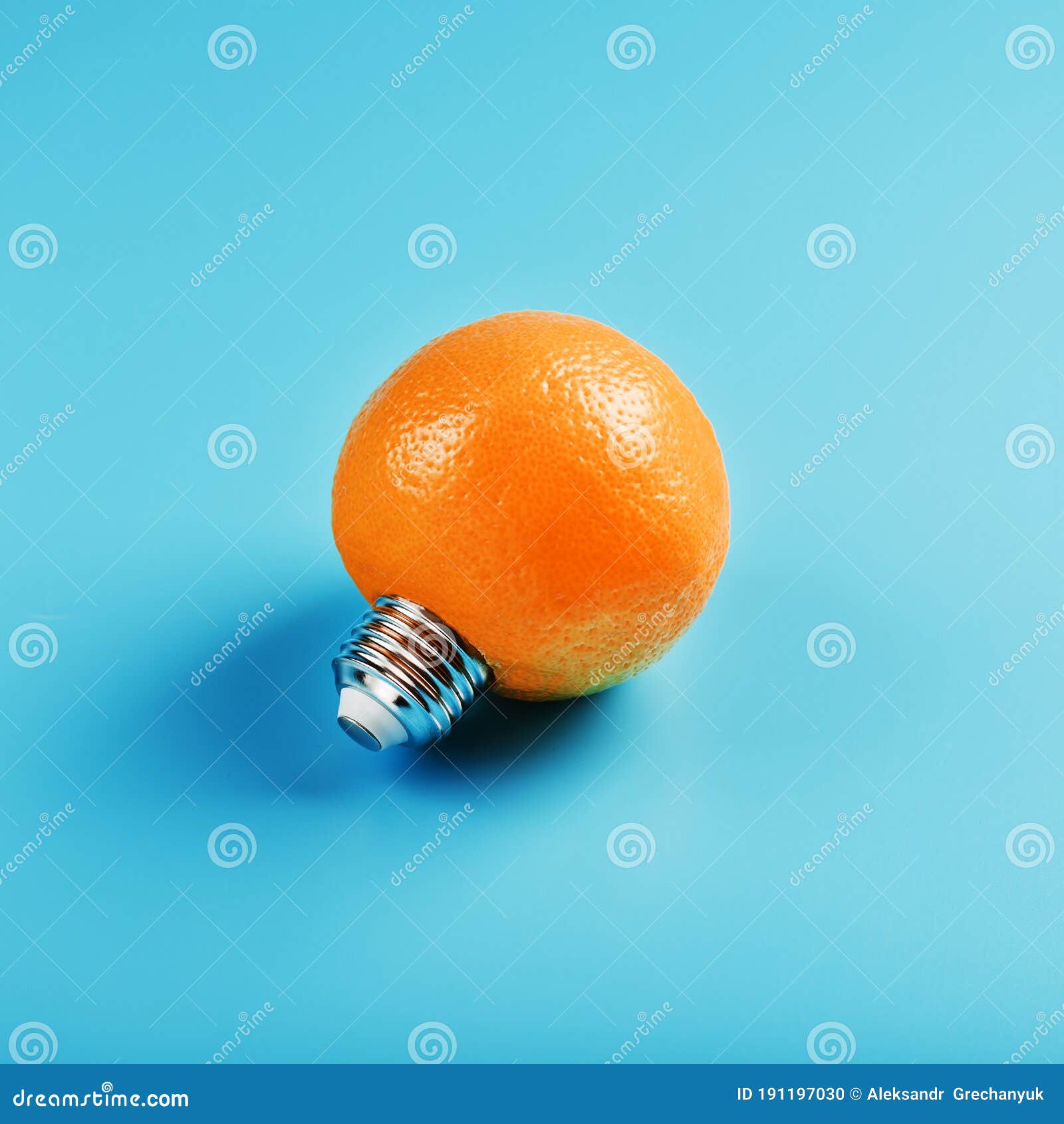 Orange Light Bulb on a Blue Background. the Concept of Fruit Ideas ...