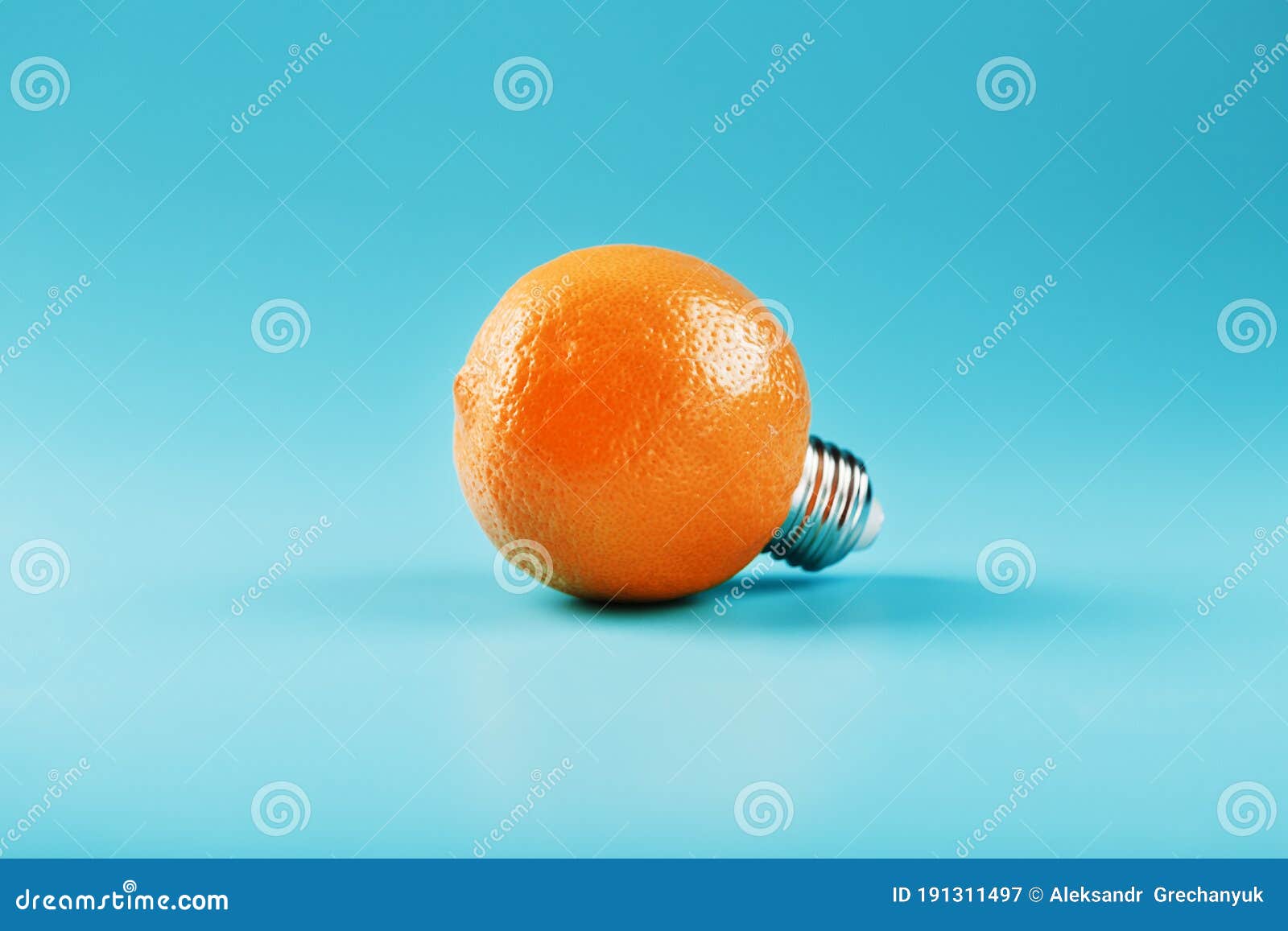 Orange Light Bulb on a Blue Background. the Concept of Fruit Ideas ...