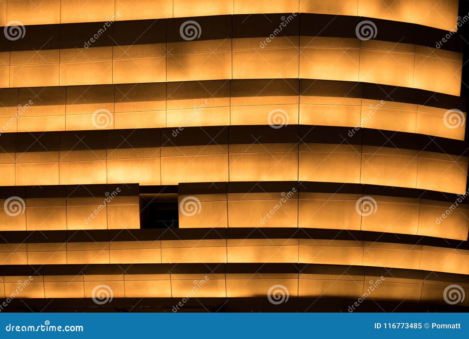Orange Light at Night on the Wall Stock Image - Image of block, dark ...