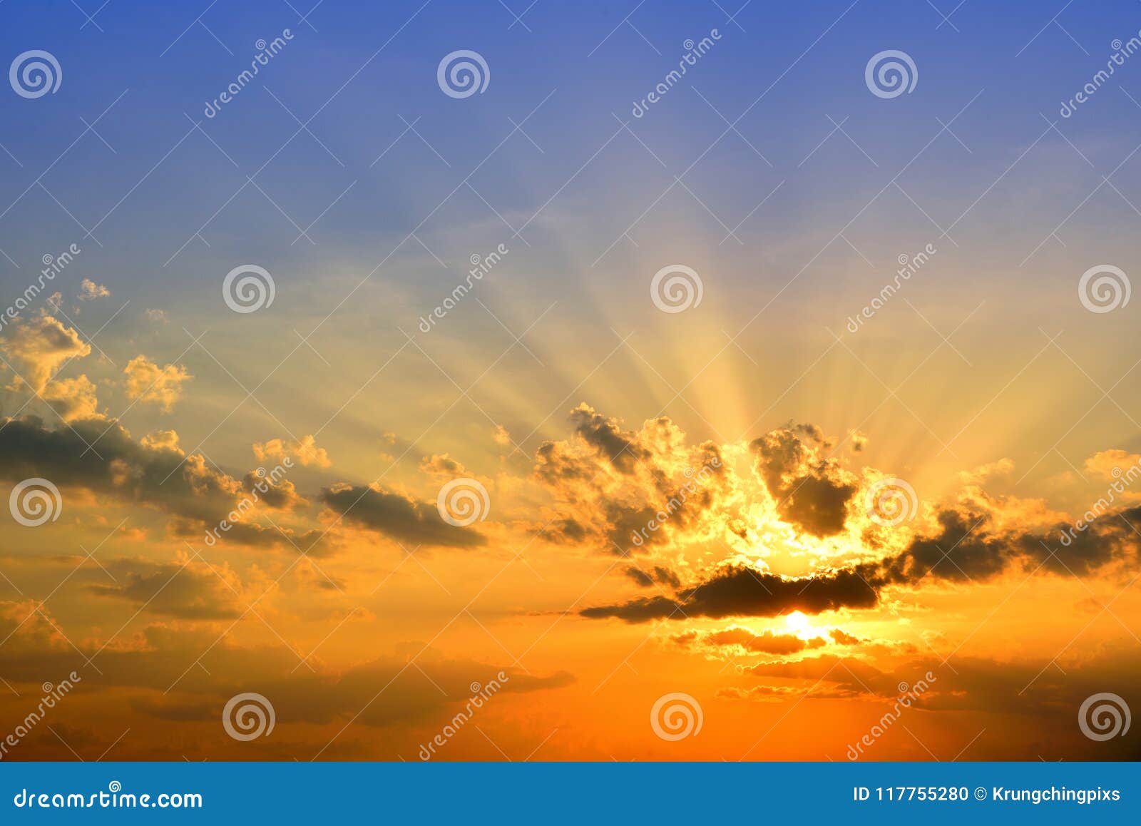 Orange Light with Sun Rays and Dark Clouds on Sky. Stock Photo - Image ...