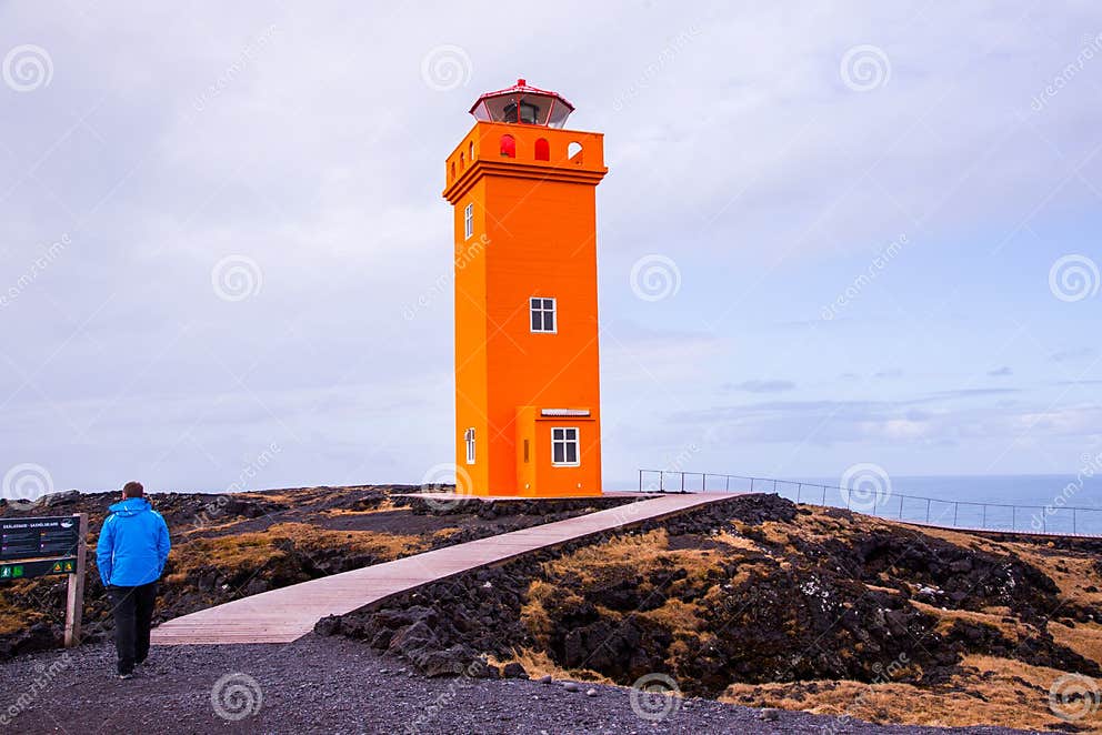 Orange Lighthouse with Human in the Foreground Editorial Image - Image ...