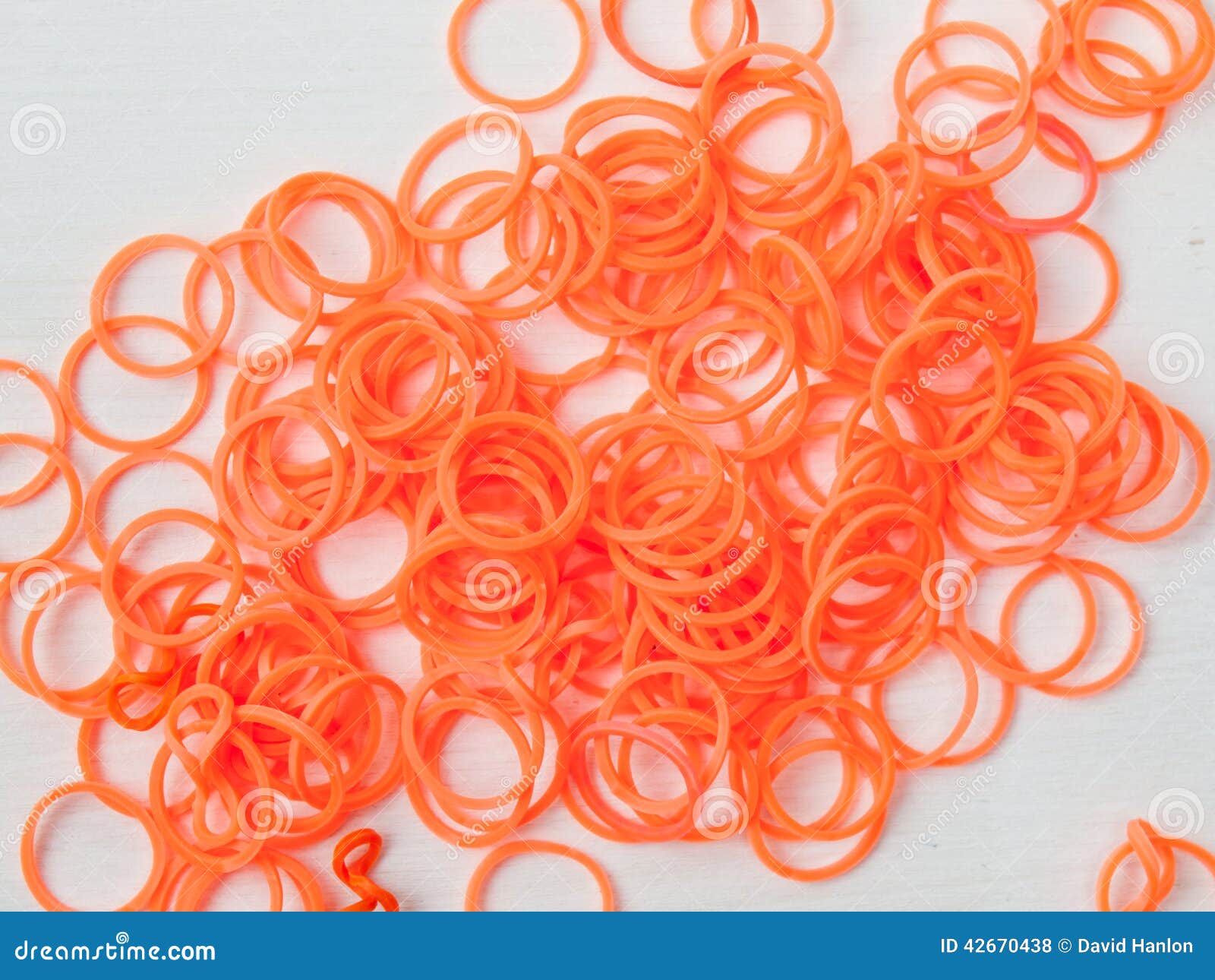Orange loom bands stock photo. Image of elastics, banding - 42670438