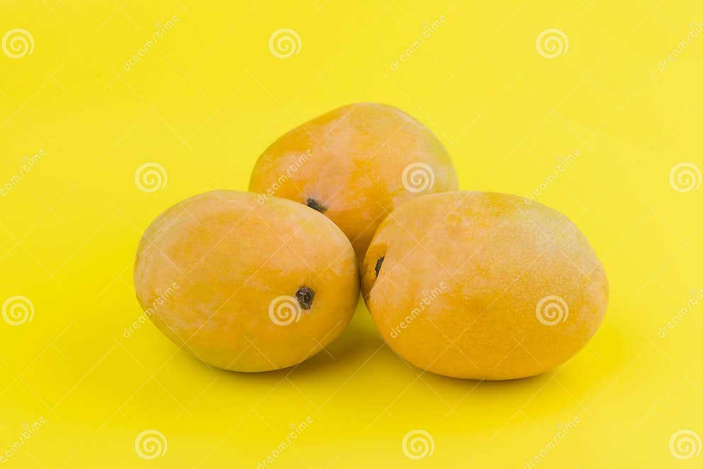 Orange Mango on Yellow Background Stock Photo - Image of juicy, fresh ...