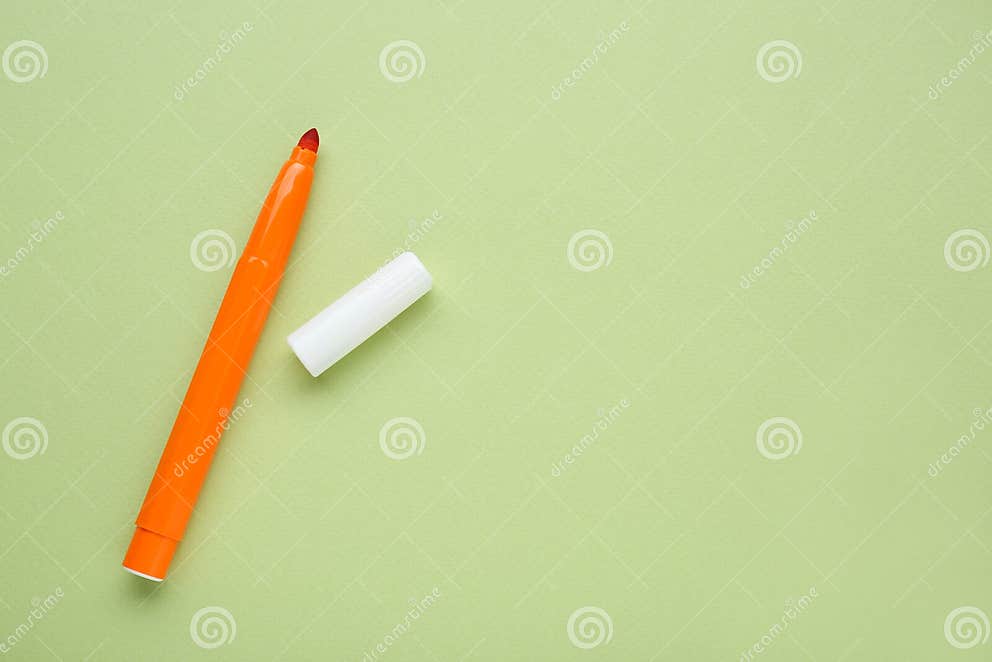 Orange Marker with Cap on Light Green Background, Flat Lay. Space for ...