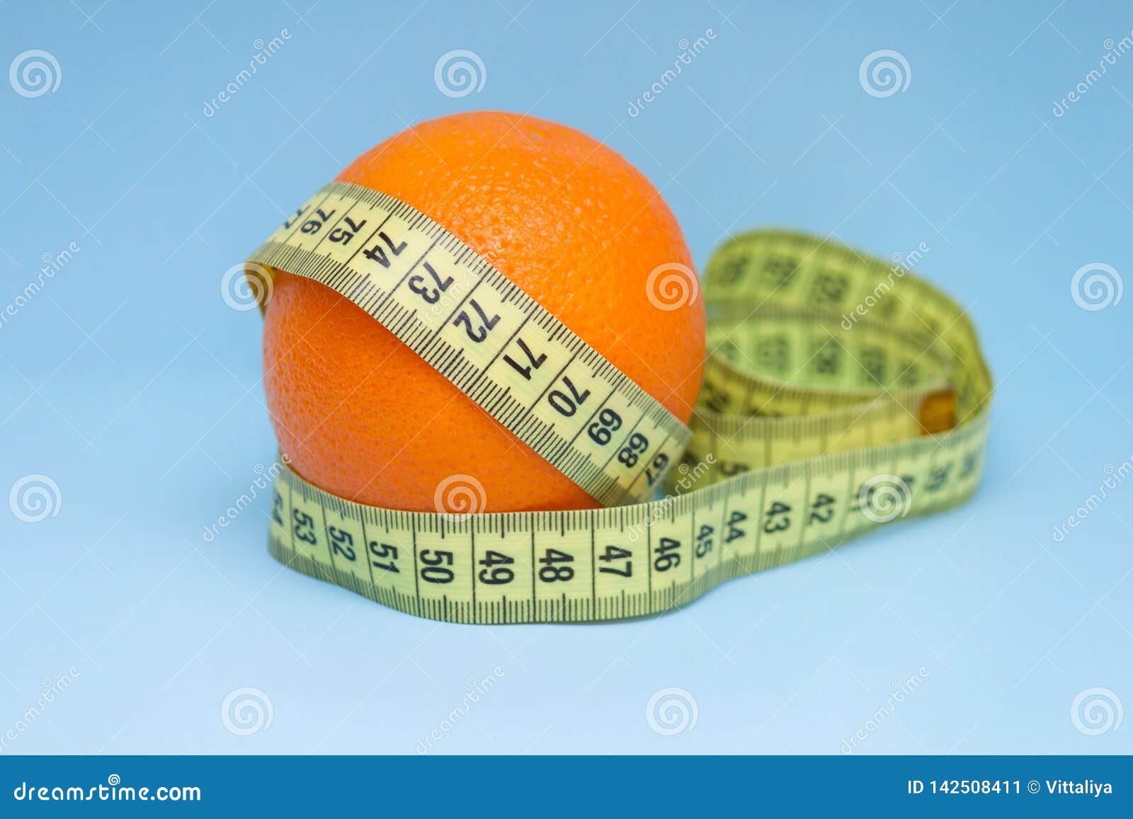 Orange with Measuring Tape Wrapped Around it on the Blue Stock Image ...
