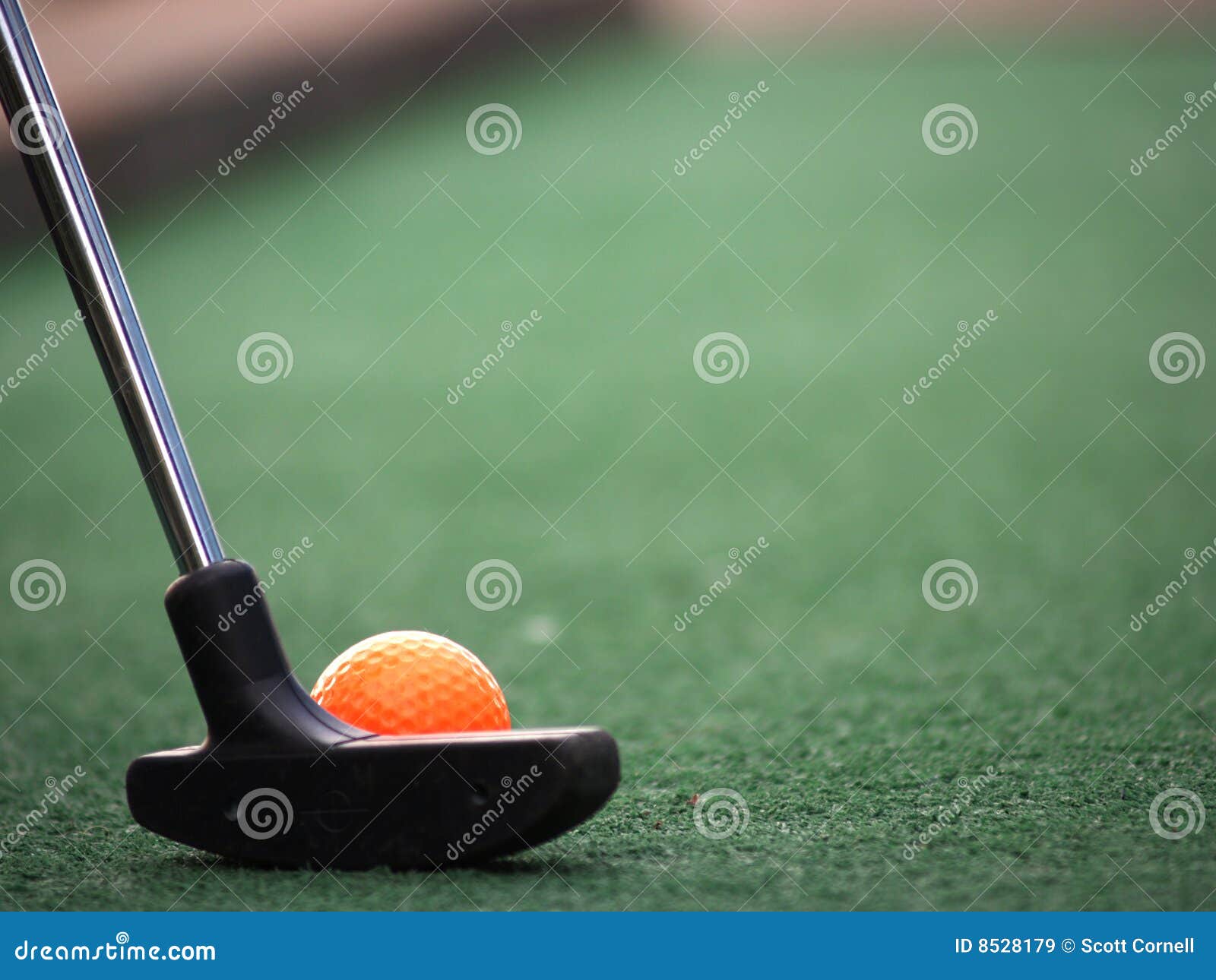 A Miniature Golf Ball Just Before Falling Into A Miniature Golf Hole ...
