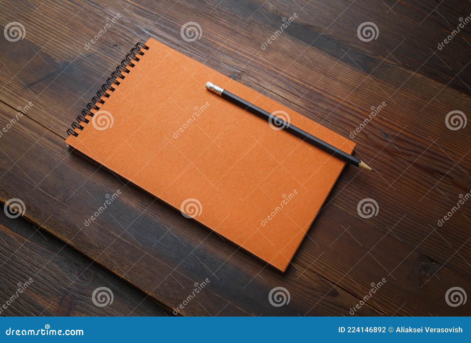 Orange notepad, pencil stock photo. Image of notepad - 224146892
