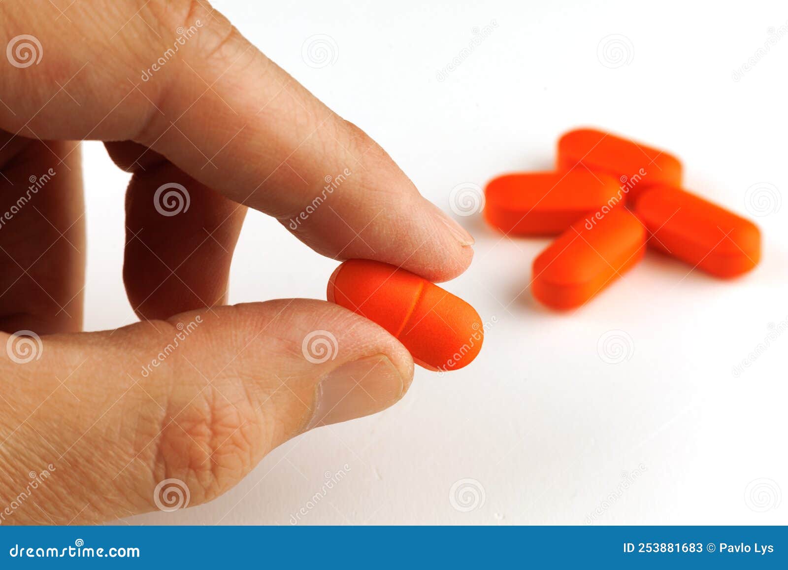 Orange Oblong Tablet in Hand Stock Image - Image of round, object ...