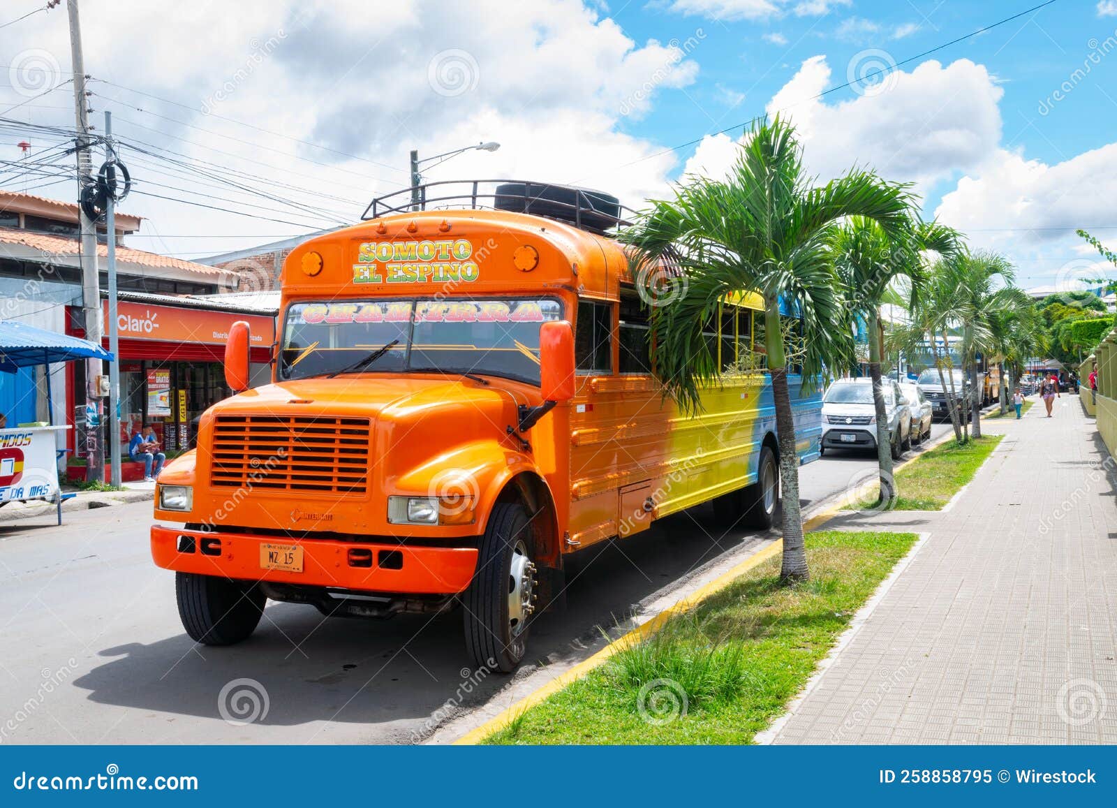 Orange Old School Bus Parked in the Street Editorial Image - Image of ...