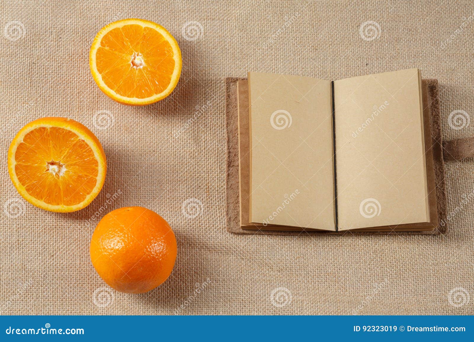 Orange and Open Notebook Lying on a Sackcloth Surface Stock Image ...