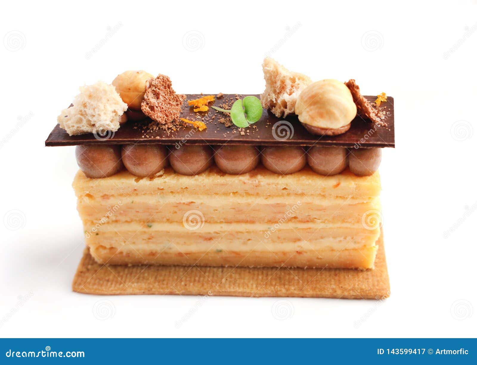 Orange Opera Cake Slice with Hazelnuts and Ganache Isolated on White ...