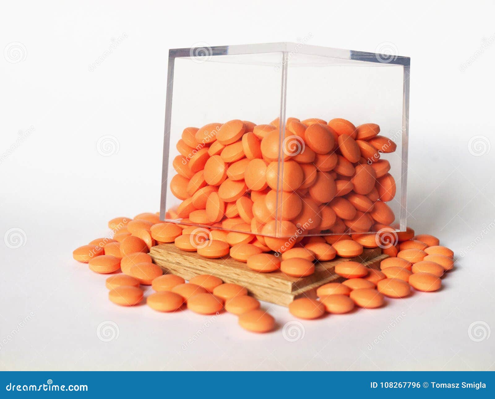 Orange Pills in a Transparent Glass Cube Stock Photo - Image of ...
