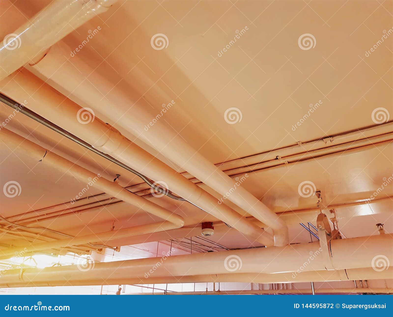 Orange Piping System Under the Ceiling Stock Photo - Image of pipe ...