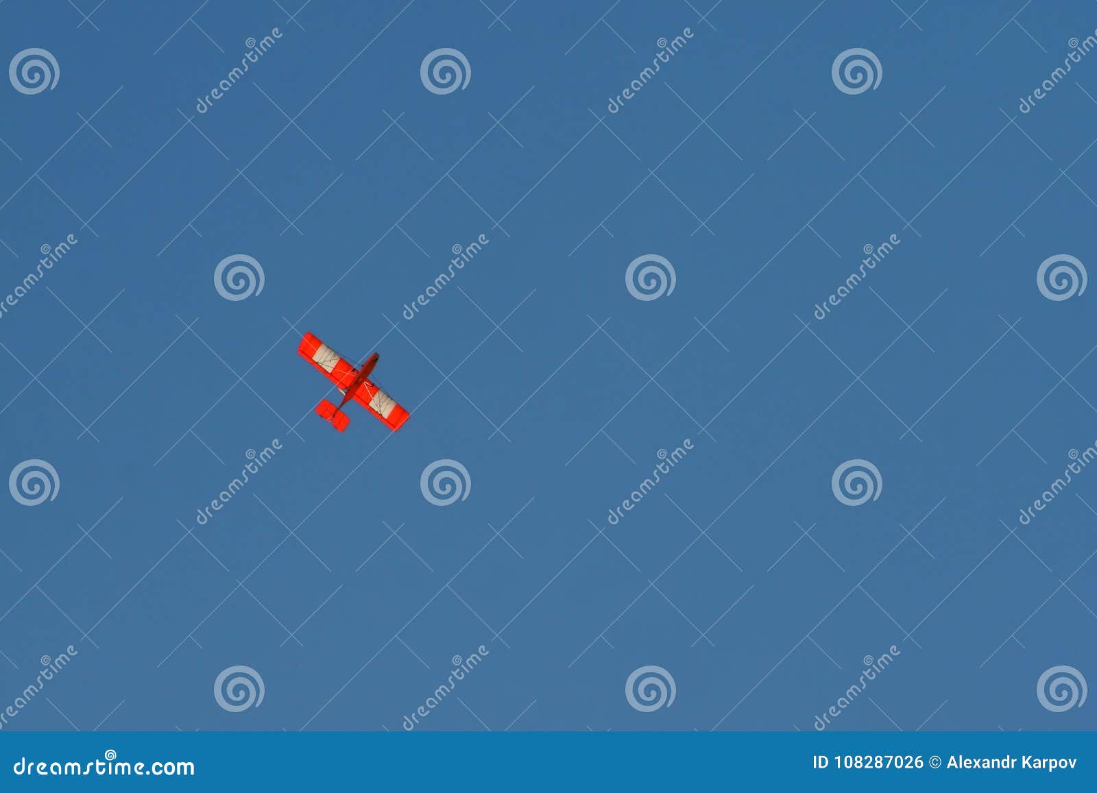 Orange plane in sky stock photo. Image of blue, light - 108287026