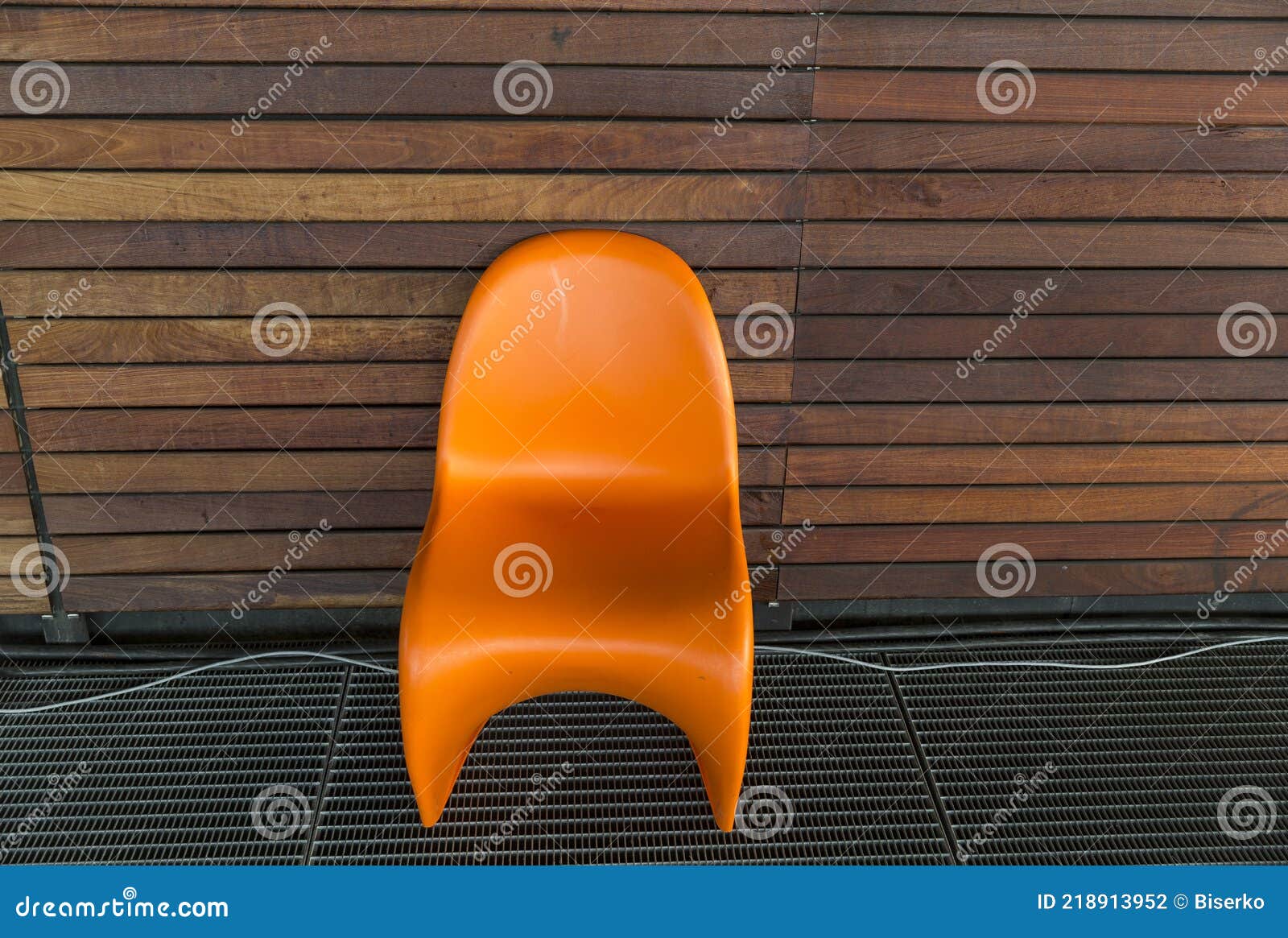 Orange plastic chair stock photo. Image of planks, environment - 218913952