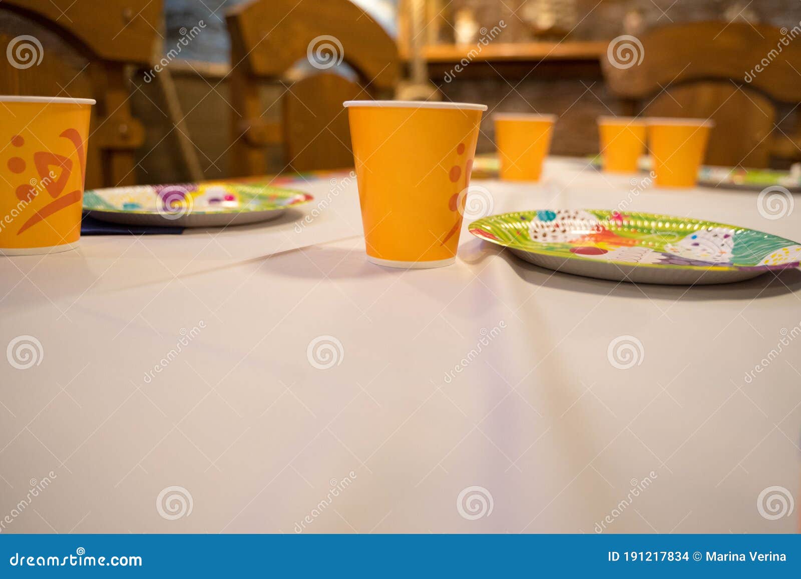 An Orange Plastic Cup Stands on the Table Stock Photo - Image of ...