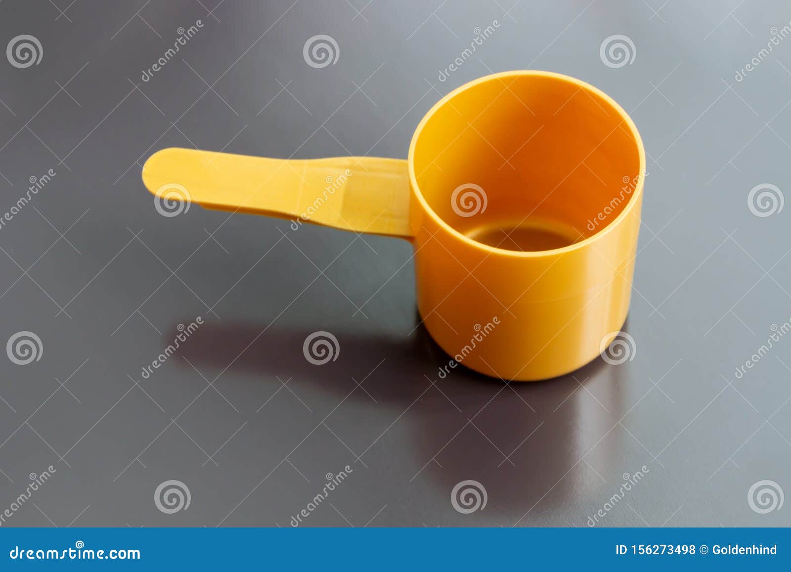 Orange Plastic Measuring Dosage Spoon on Dark Background Stock Photo ...