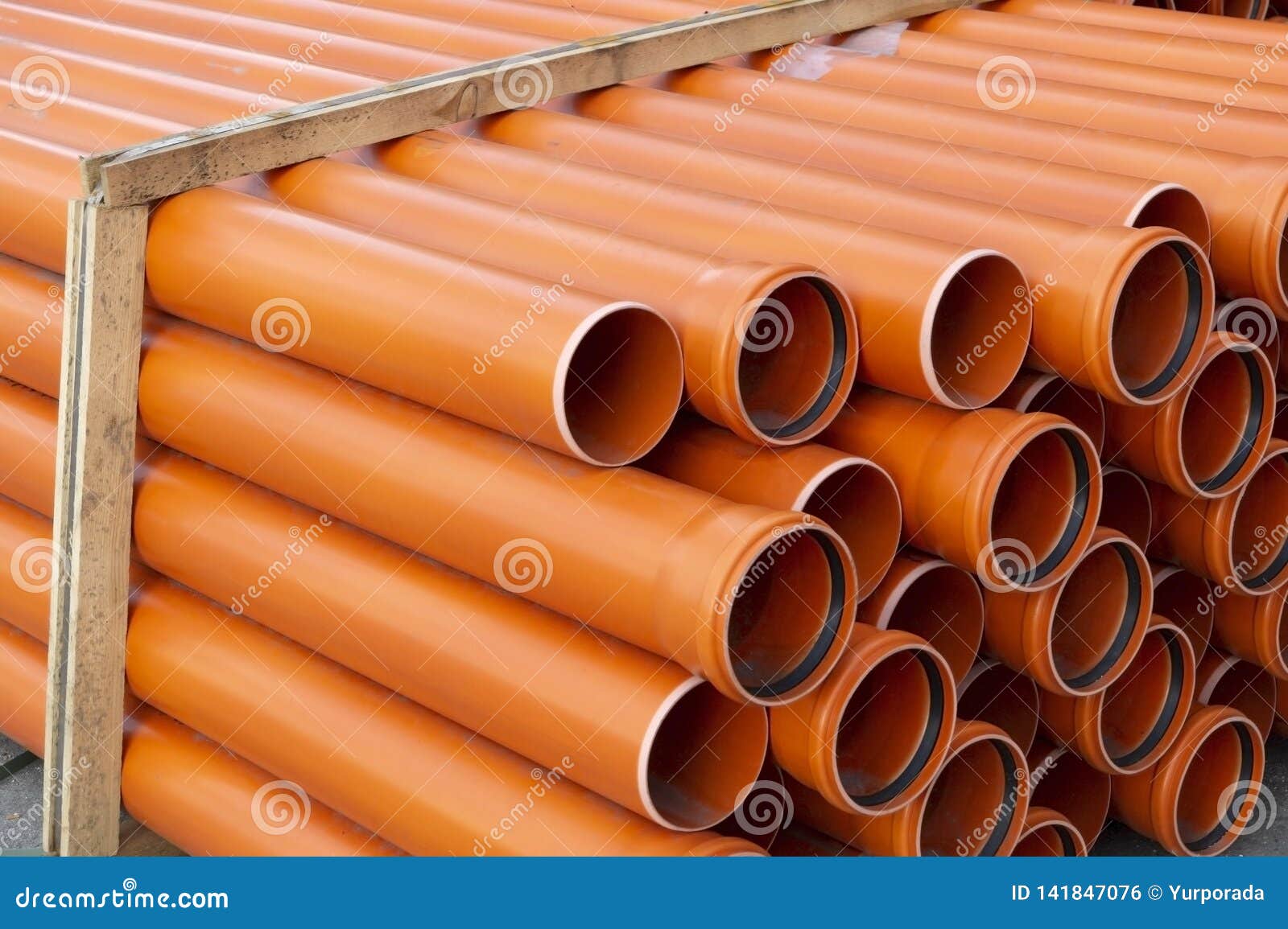 Orange Plastic Plumbing Pipes on a Pallet. Stock Photo - Image of ...
