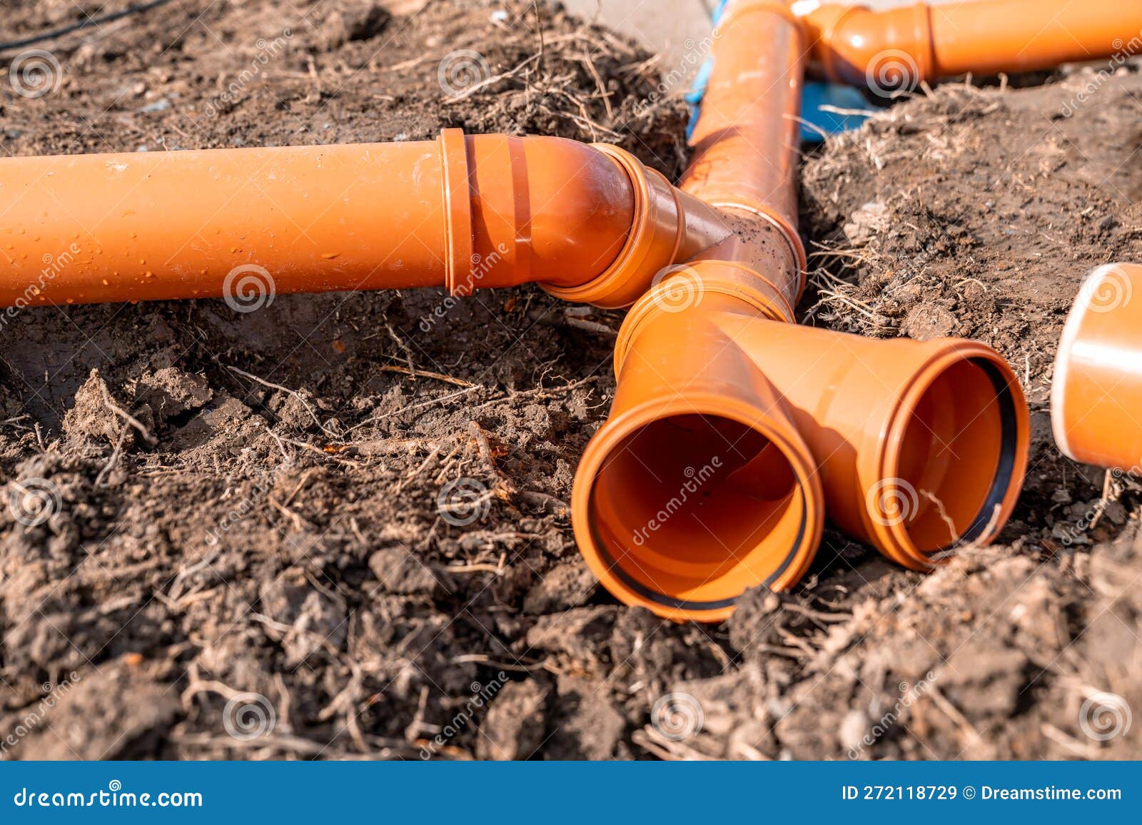 Orange Plastic PVC Pipes in the Ground Stock Image - Image of ...