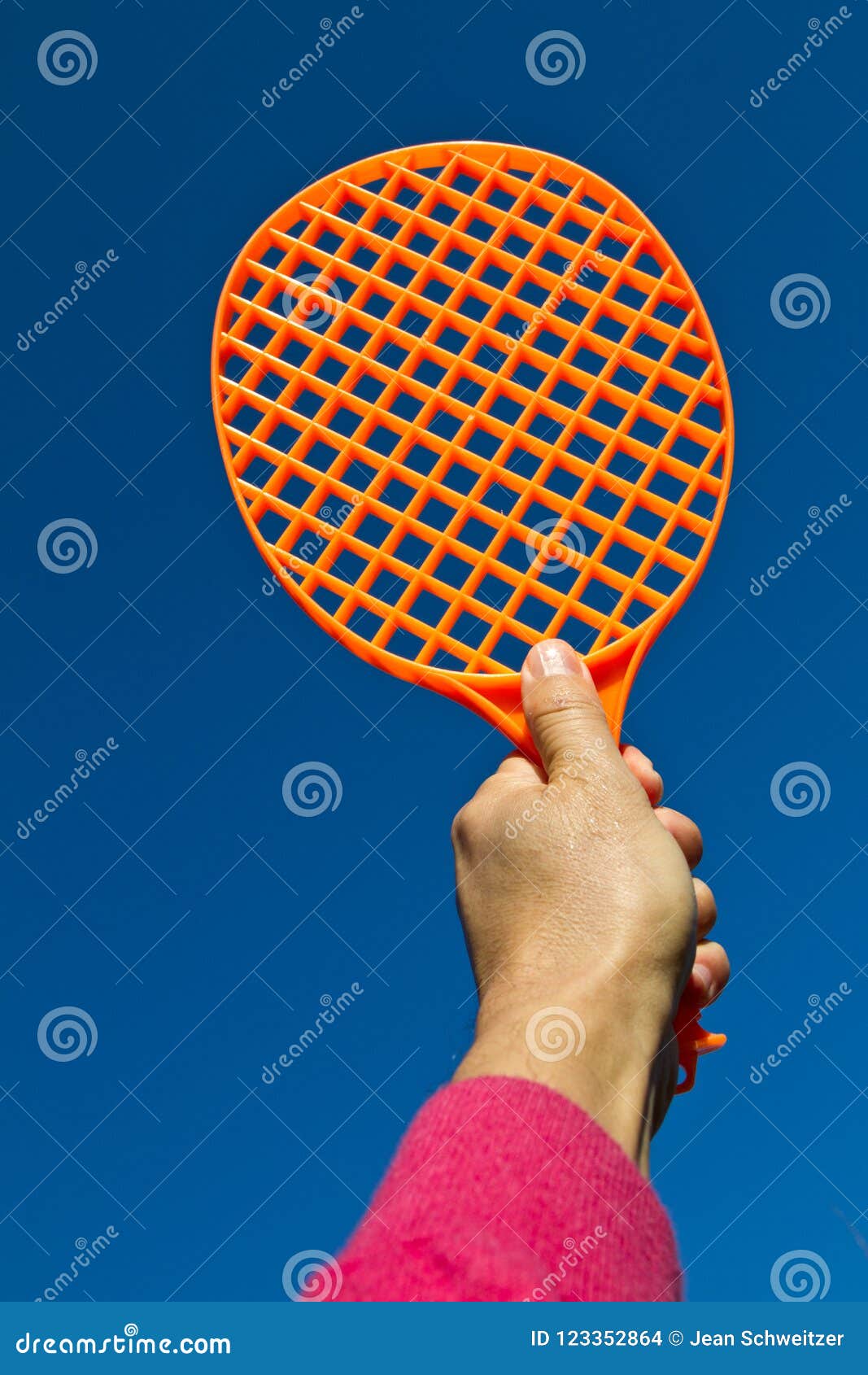 Orange plastic racket stock photo. Image of plastic - 123352864