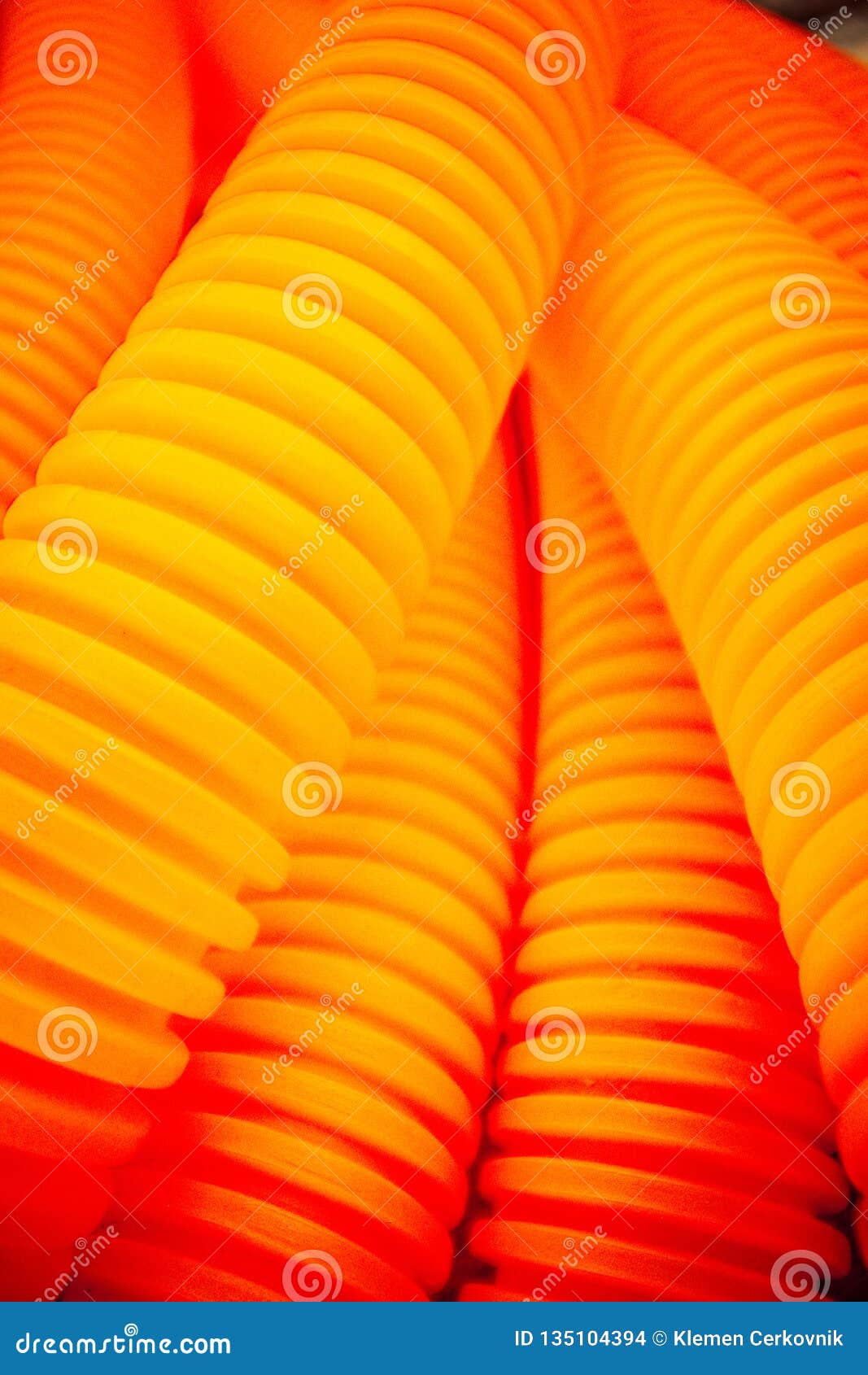 Orange plastic tubes stock photo. Image of detail, plastic - 135104394