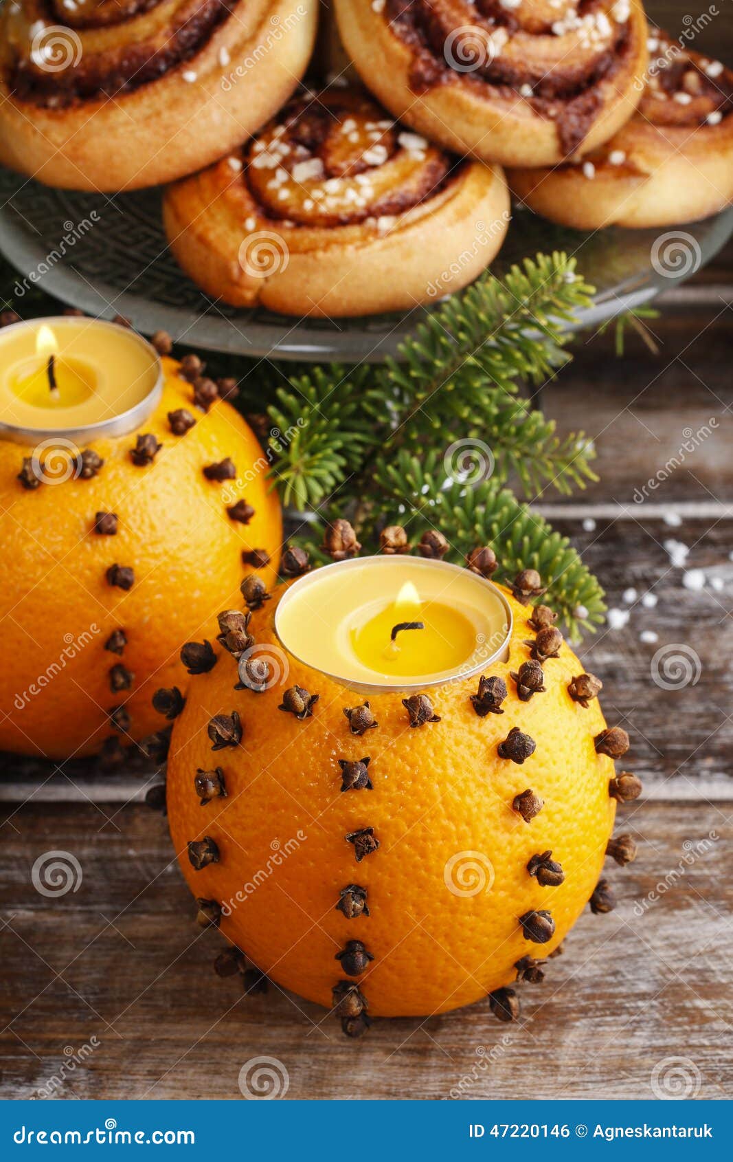 Orange Pomander Balls with Candles and Cinnamon Rolls Stock Photo ...