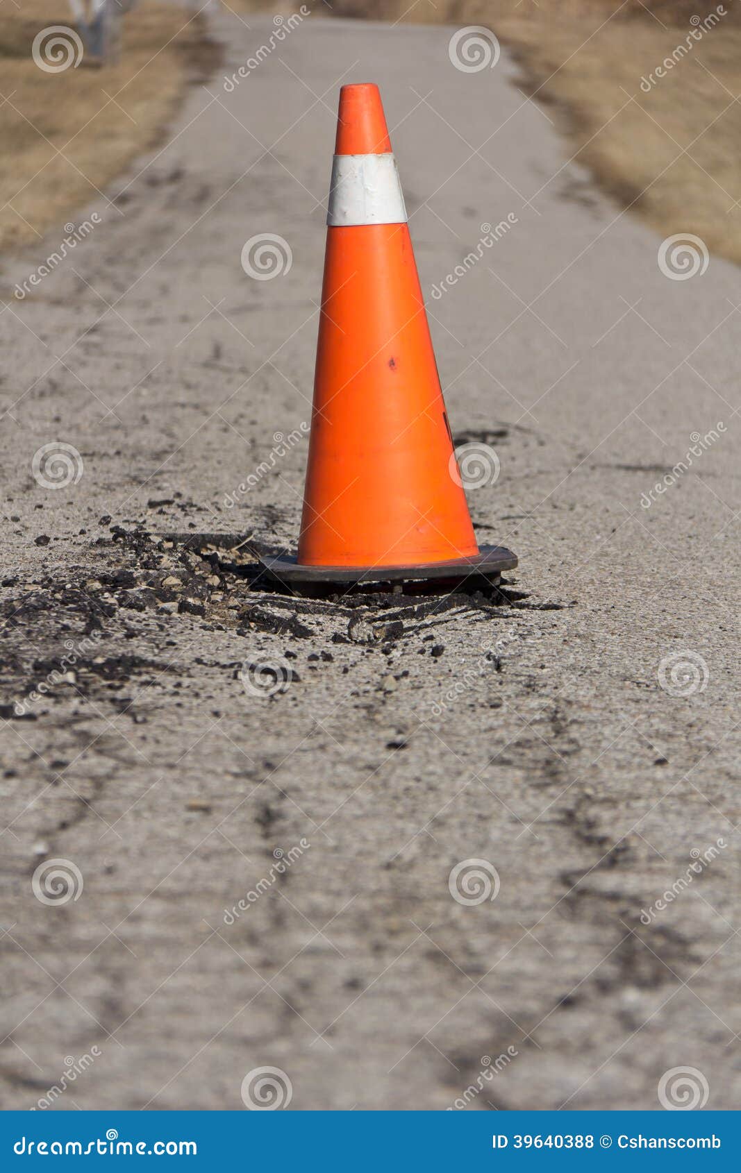 Orange Pylon on Damaged Road Stock Photo - Image of careful ...