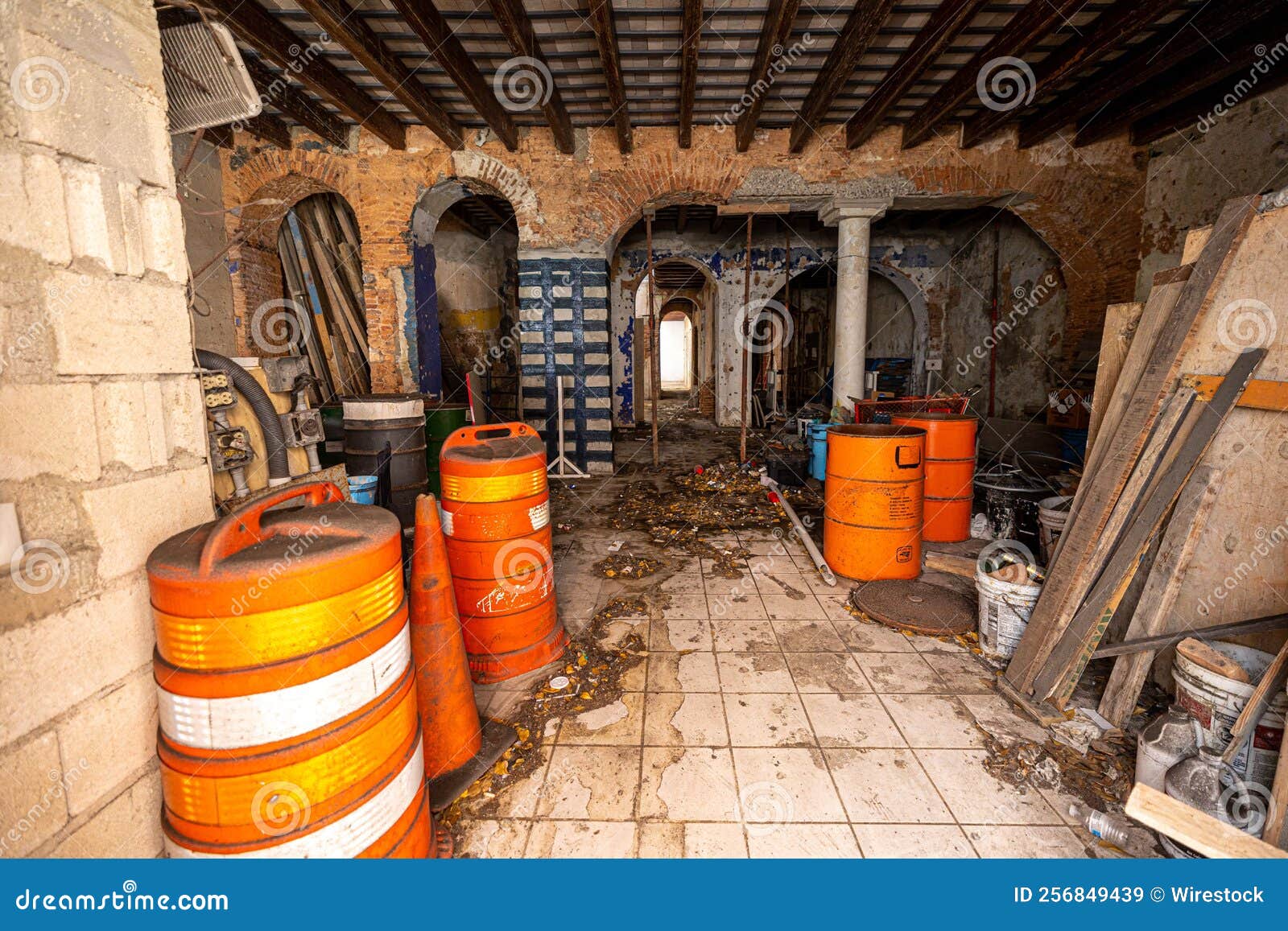 Orange Road Construction Barrels Inside Dirty Damaged Building Stock ...