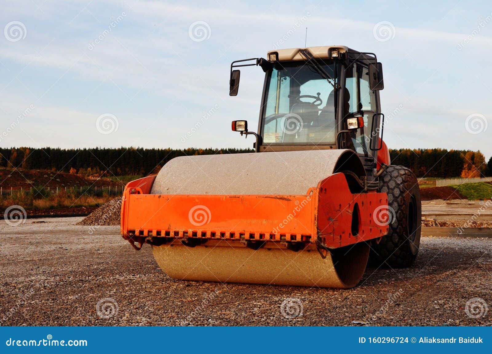 Orange Road Roller at the Road Construction. Construction Machinery ...