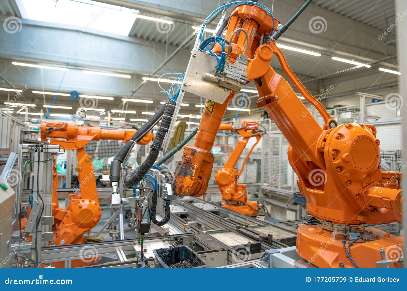 Orange Robot Arms on the Production Line. Controlled by a Computer with ...