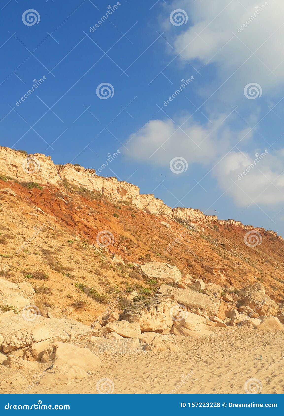 An Orange Rocky Cliff by the Beach Stock Photo - Image of rocky, orange ...